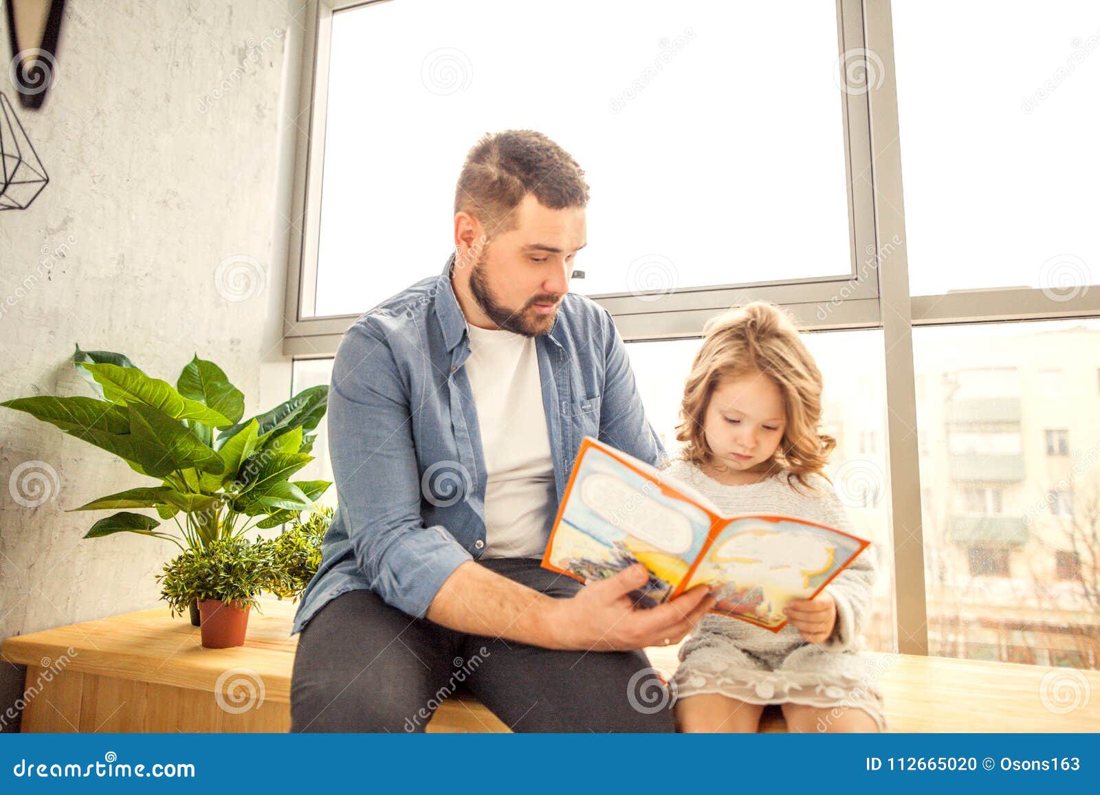 Dad and Daughter Reading a Book at Home Stock Photo - Image of female ...