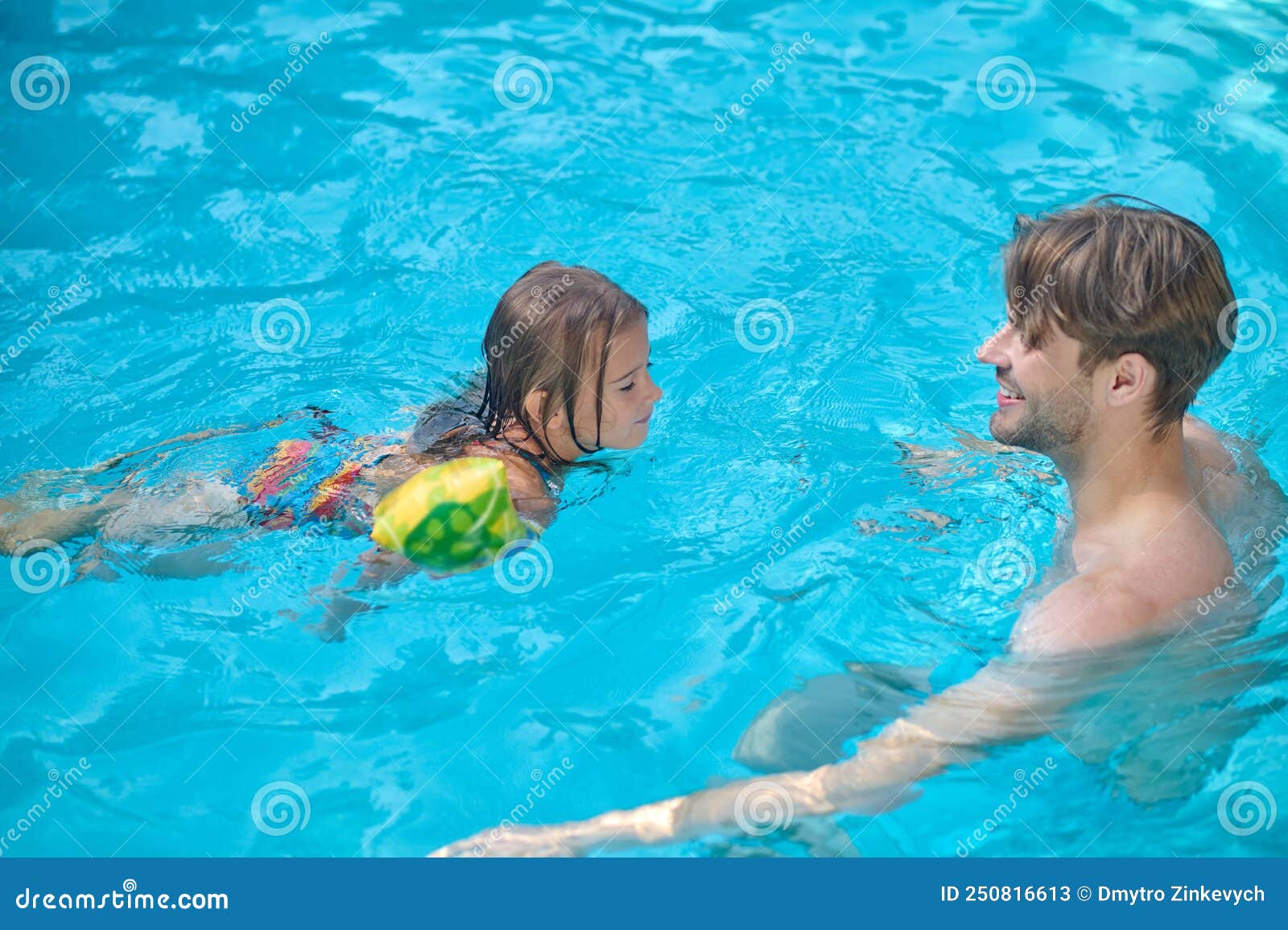 Dad And Daughter Swimming Together In A Swimming Pool Stock Image Image Of Goodlooking