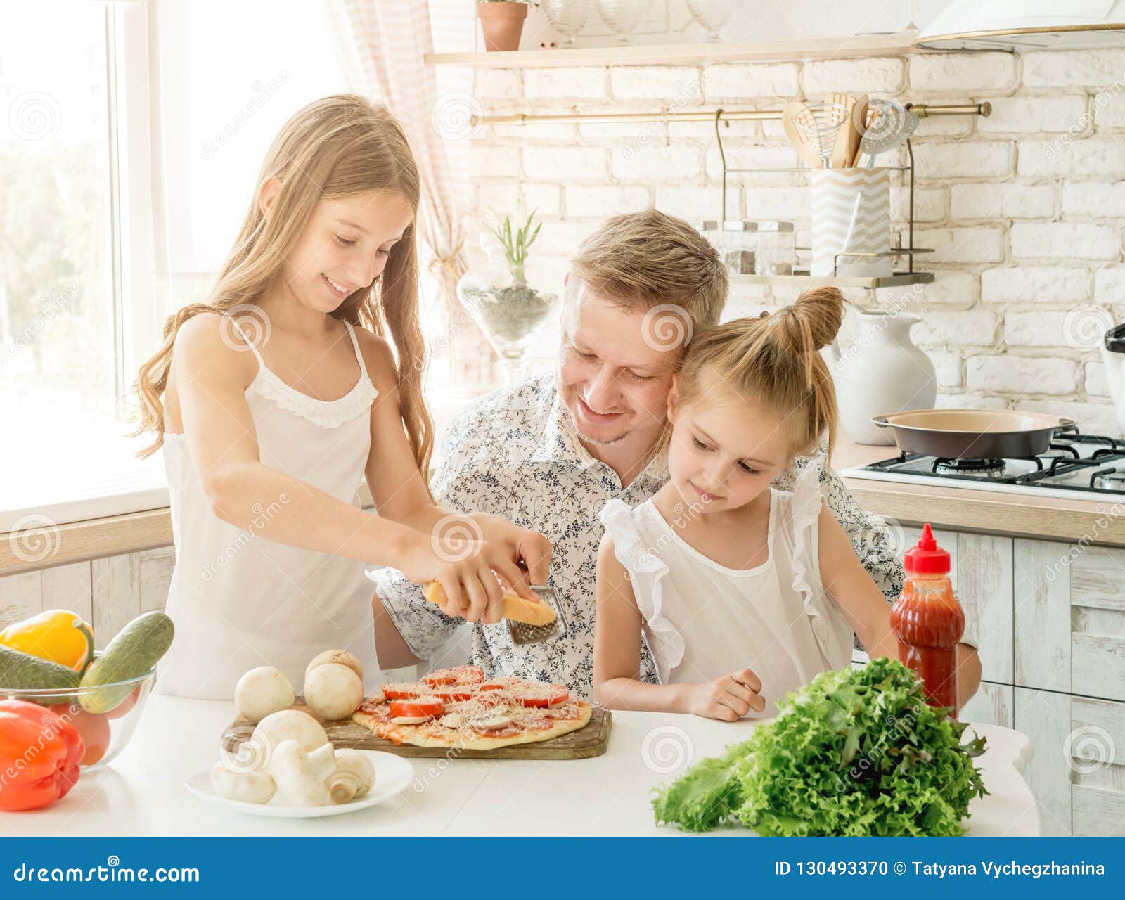 Dad with Daughters Preparing Pizza Stock Photo - Image of caucasian ...