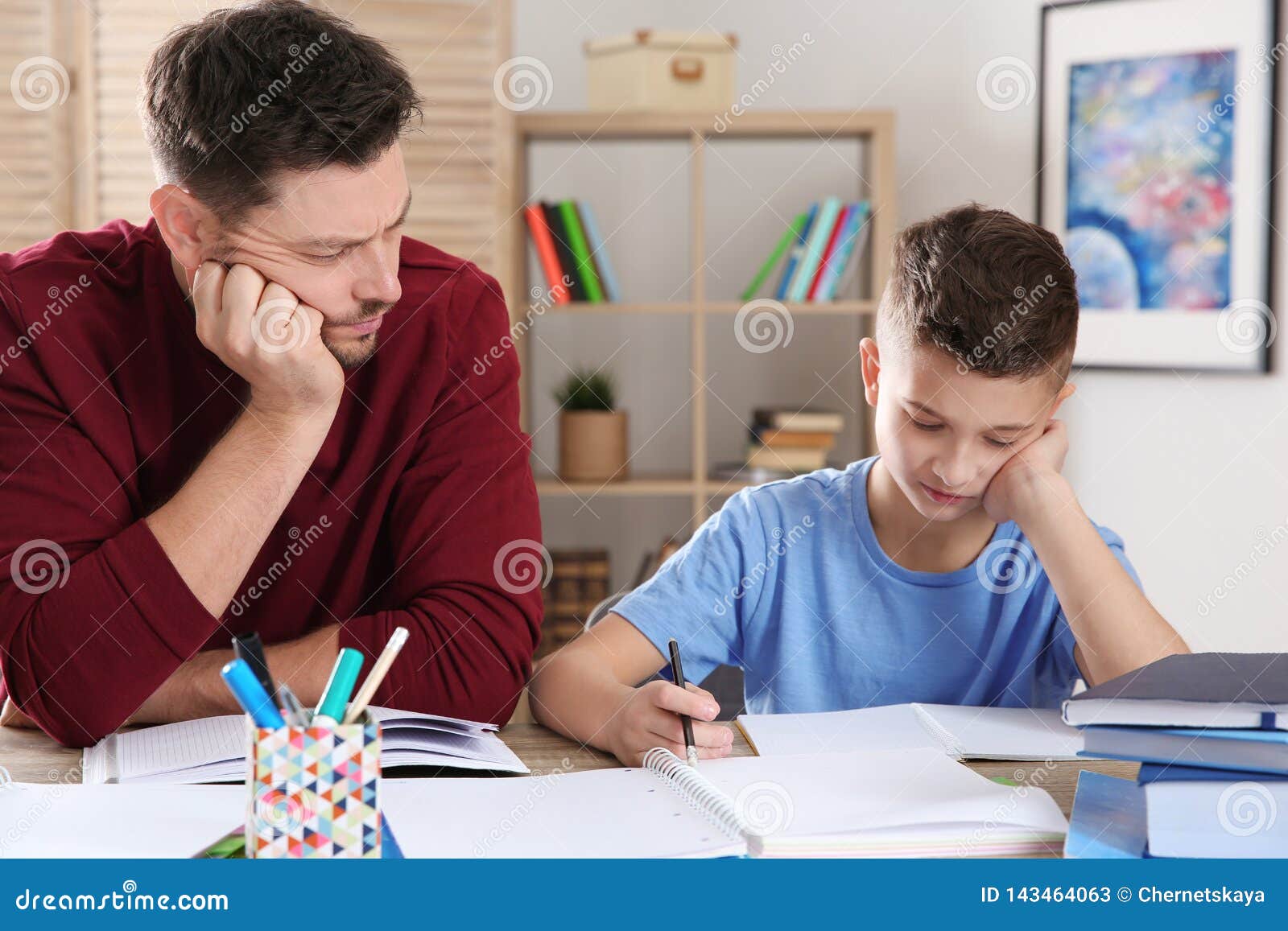 Dad Helping His Son with Difficult Homework Assignment Stock Image ...