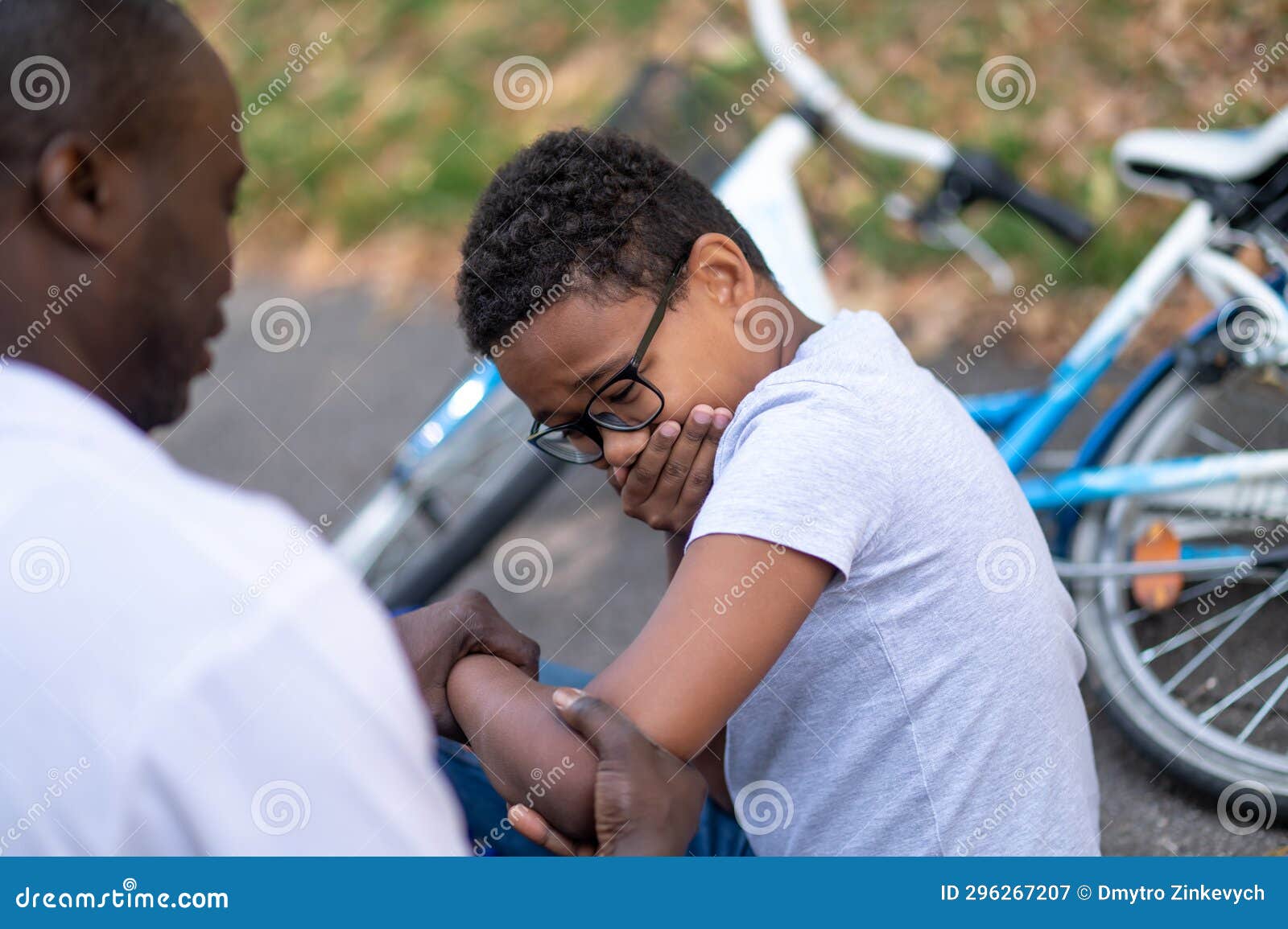 Dad Helping His Son after Falling Down from a Bike Stock Image - Image ...