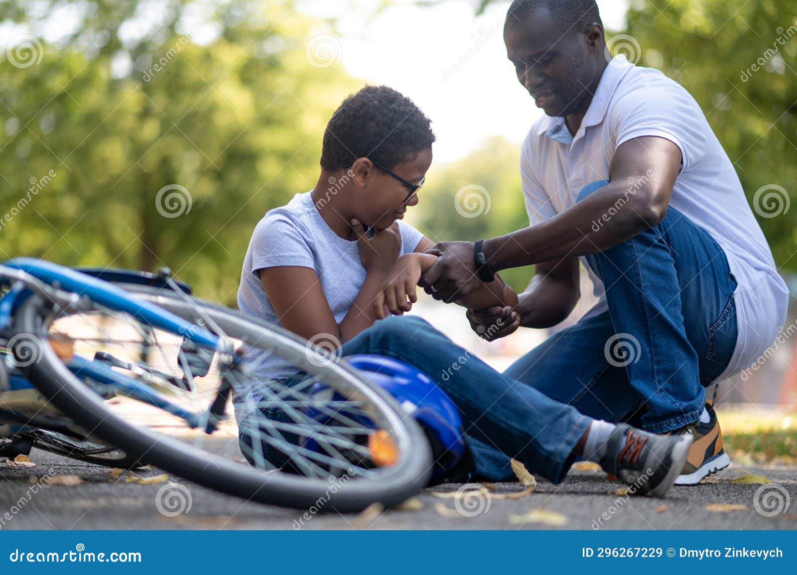 Dad Helping His Son after Falling Down from a Bike Stock Image - Image ...