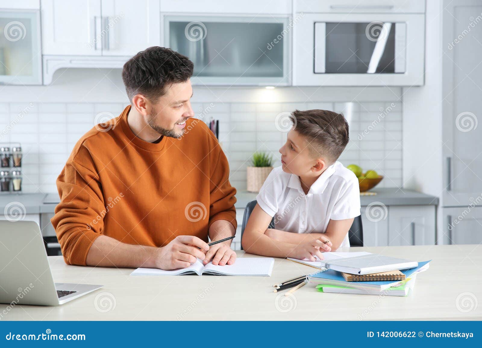 Dad Helping His Son with Homework Stock Photo - Image of happy, father ...