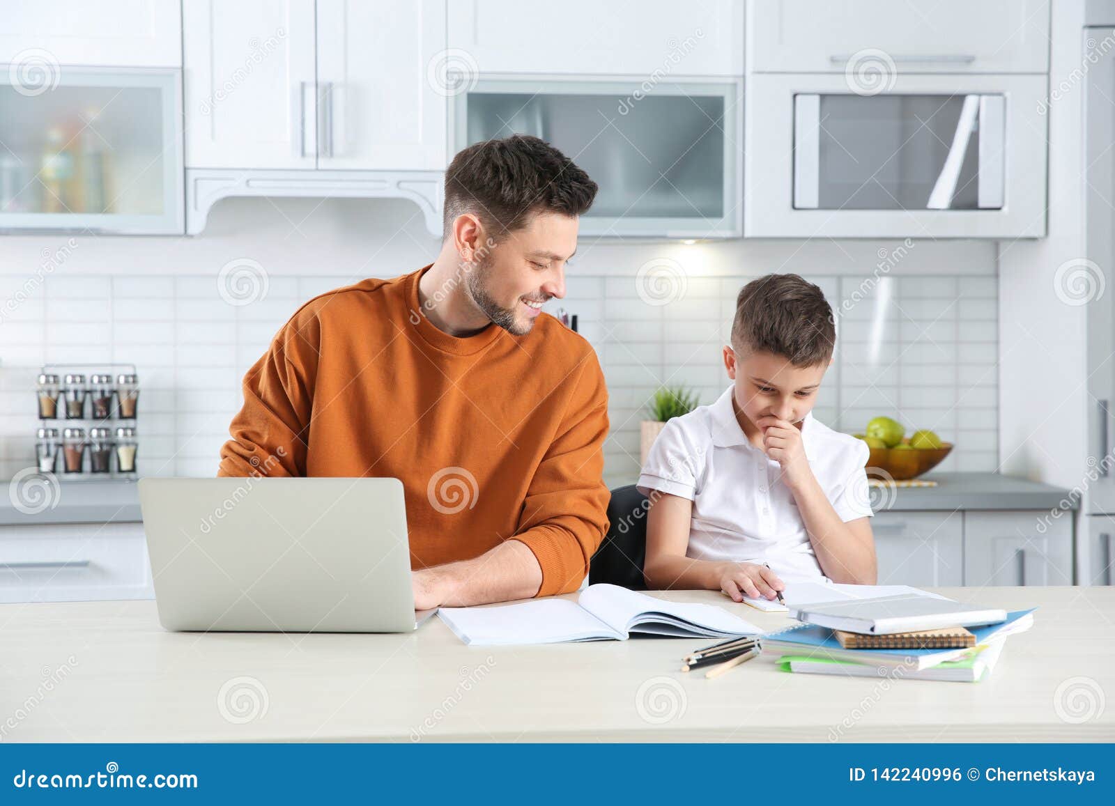 Dad Helping His Son with Homework Stock Photo - Image of parent, ideas ...