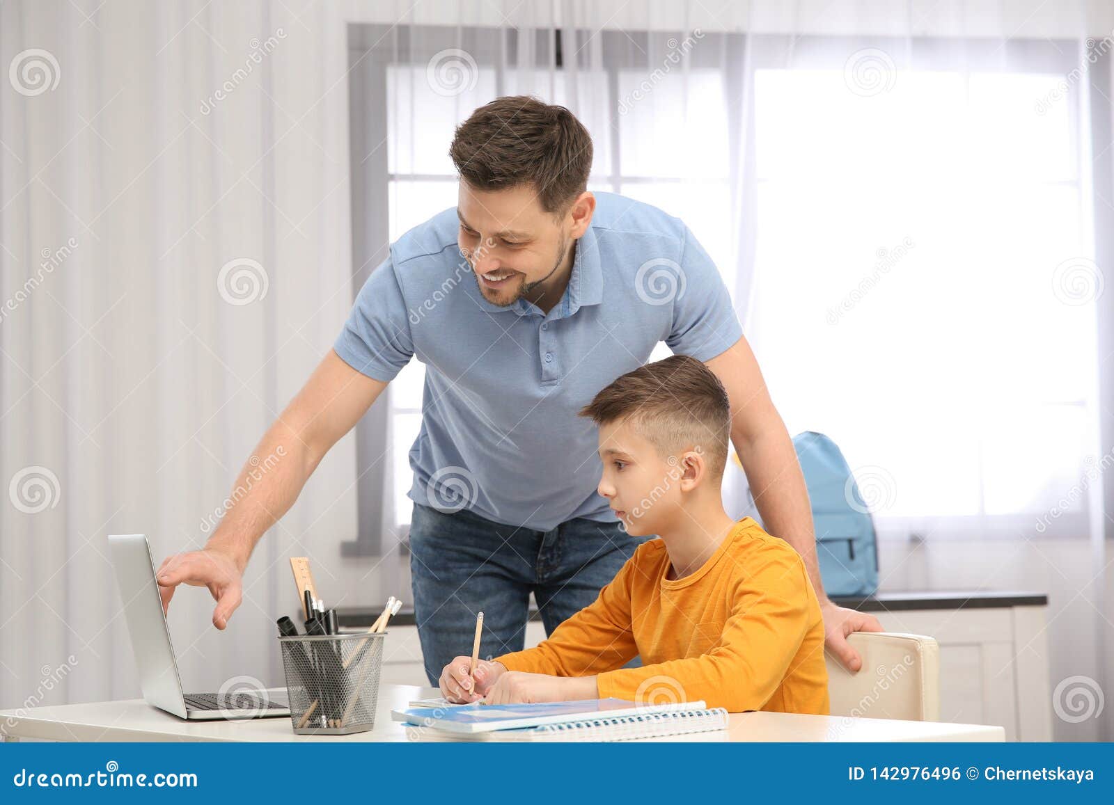 Dad Helping His Son with Homework Stock Photo - Image of exercise ...