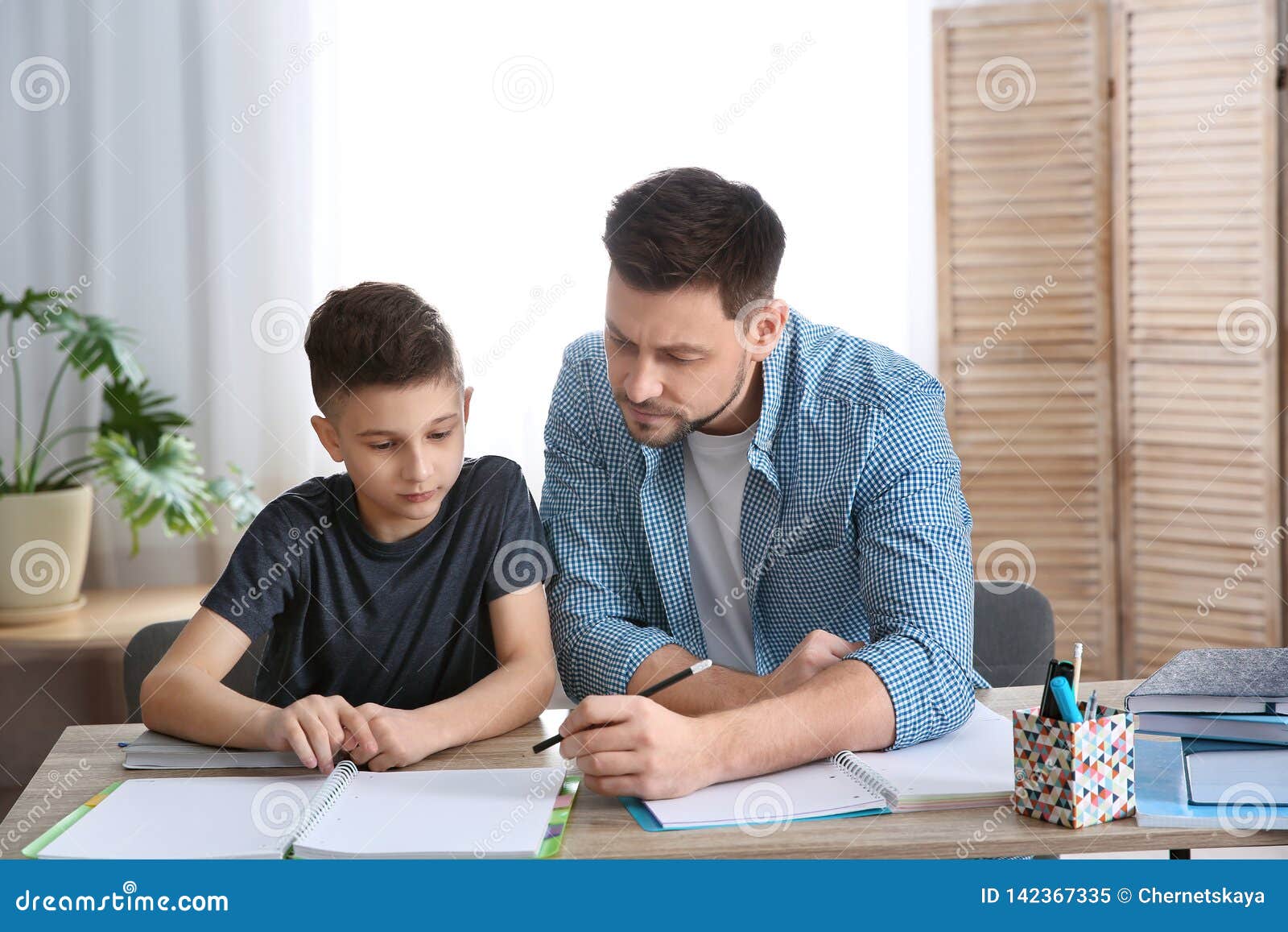 Dad Helping His Son with Homework Stock Image - Image of learn, mature ...