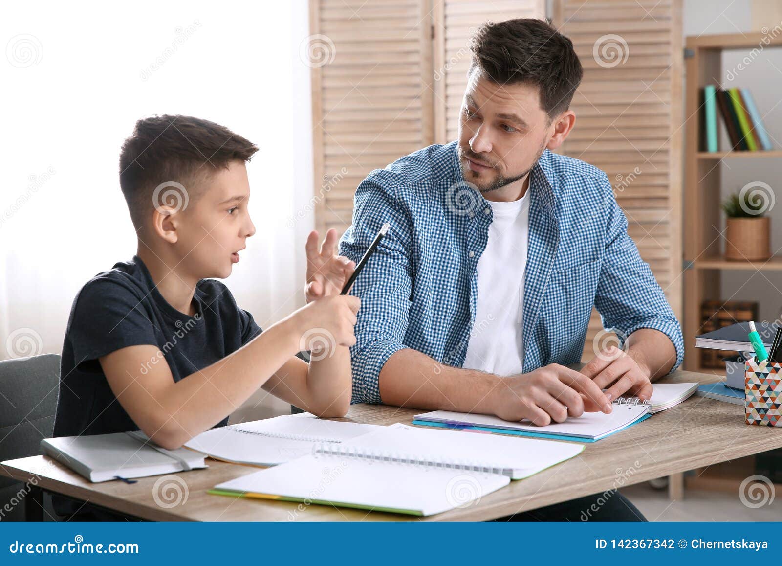 Dad Helping His Son with Homework Stock Photo - Image of little, home ...