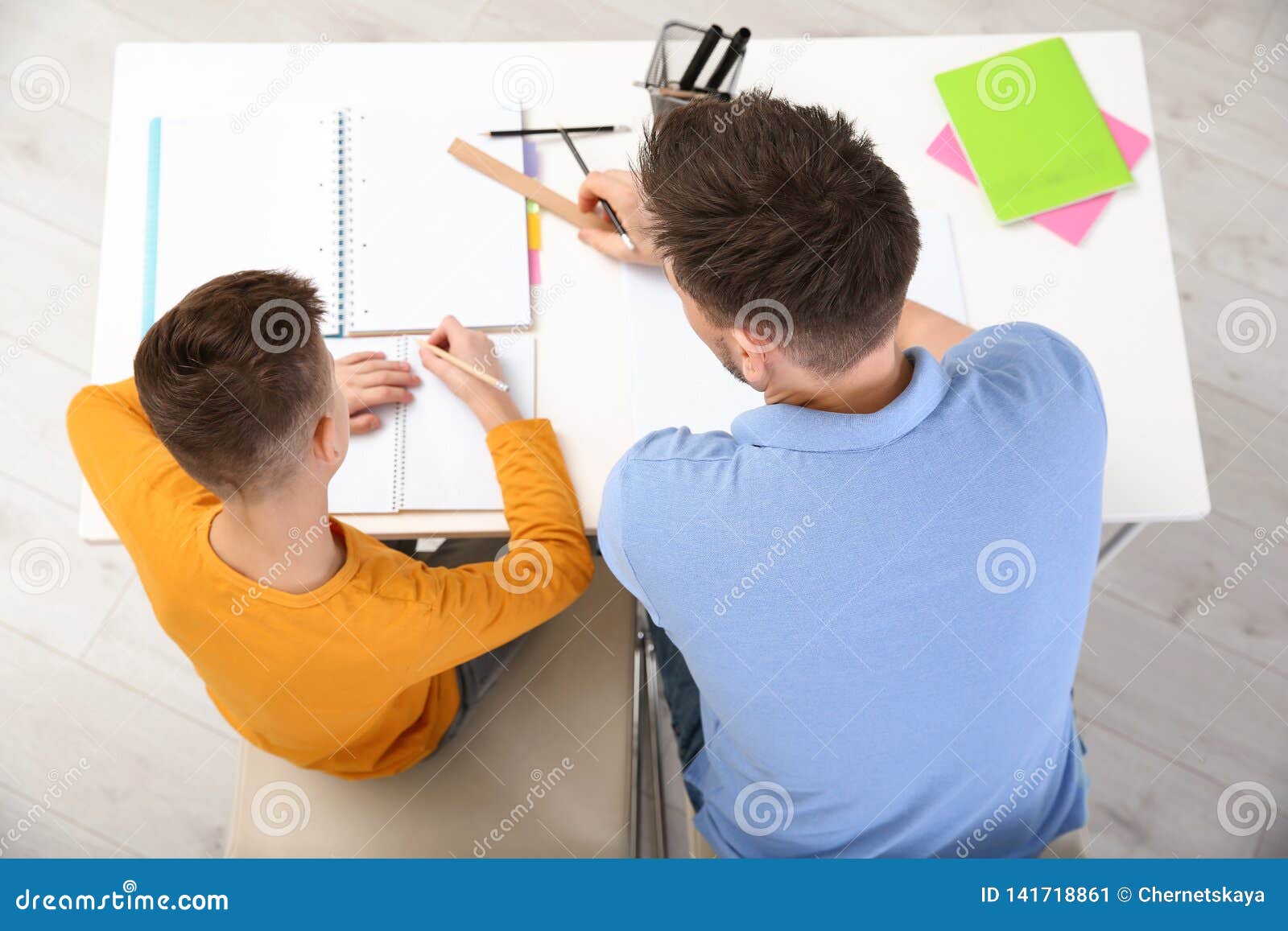 Dad Helping His Son with Homework in Room Stock Image - Image of study ...