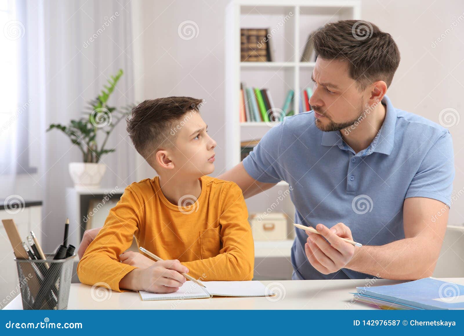 Dad Helping His Son with Homework Stock Image - Image of assignment ...