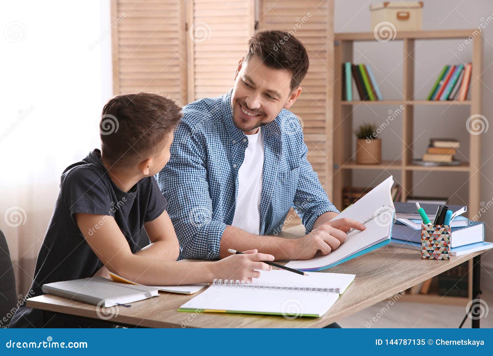 Dad Helping His Son with Homework Stock Image - Image of little ...