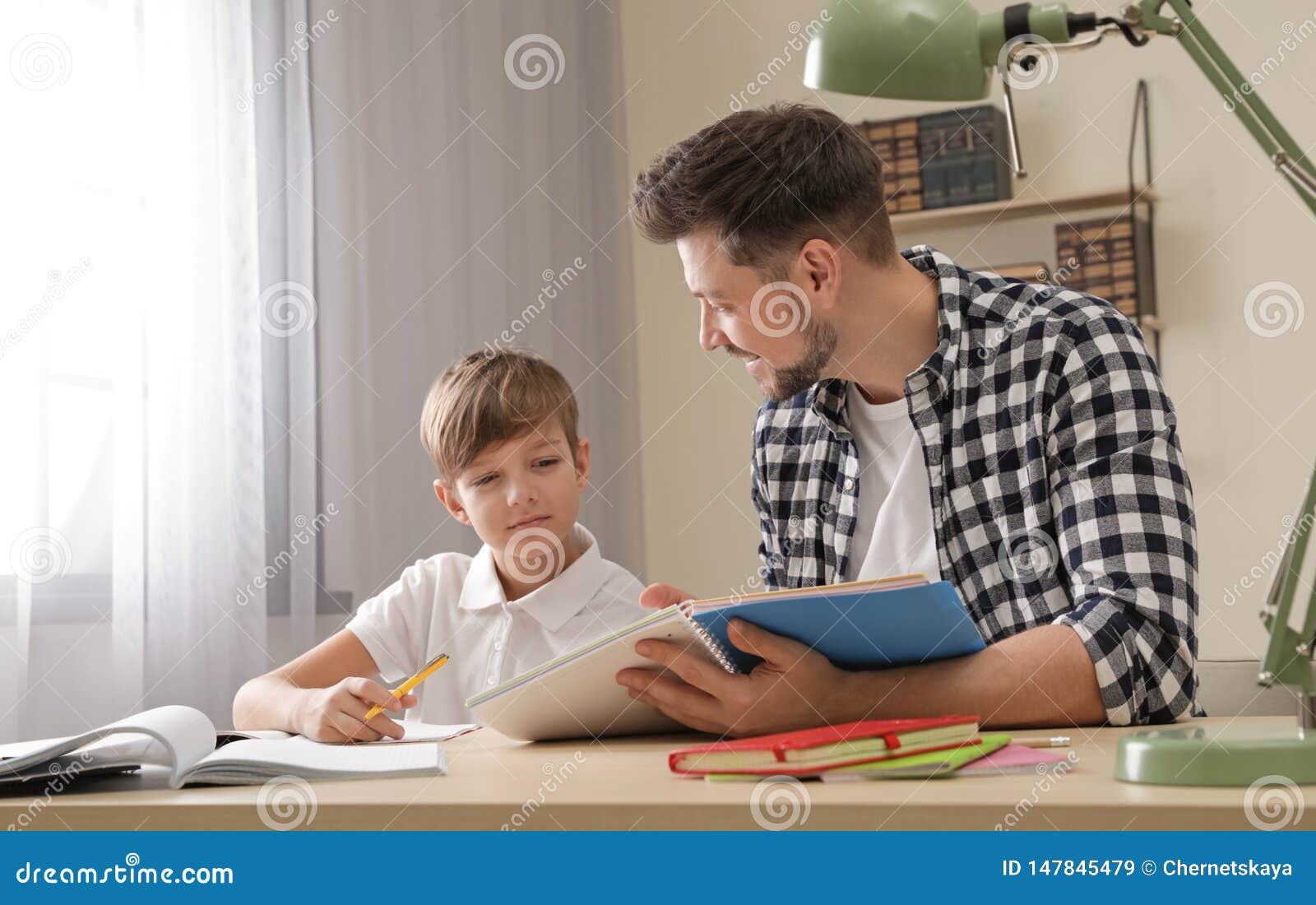 Dad Helping His Son with School Assignment Stock Image - Image of ...