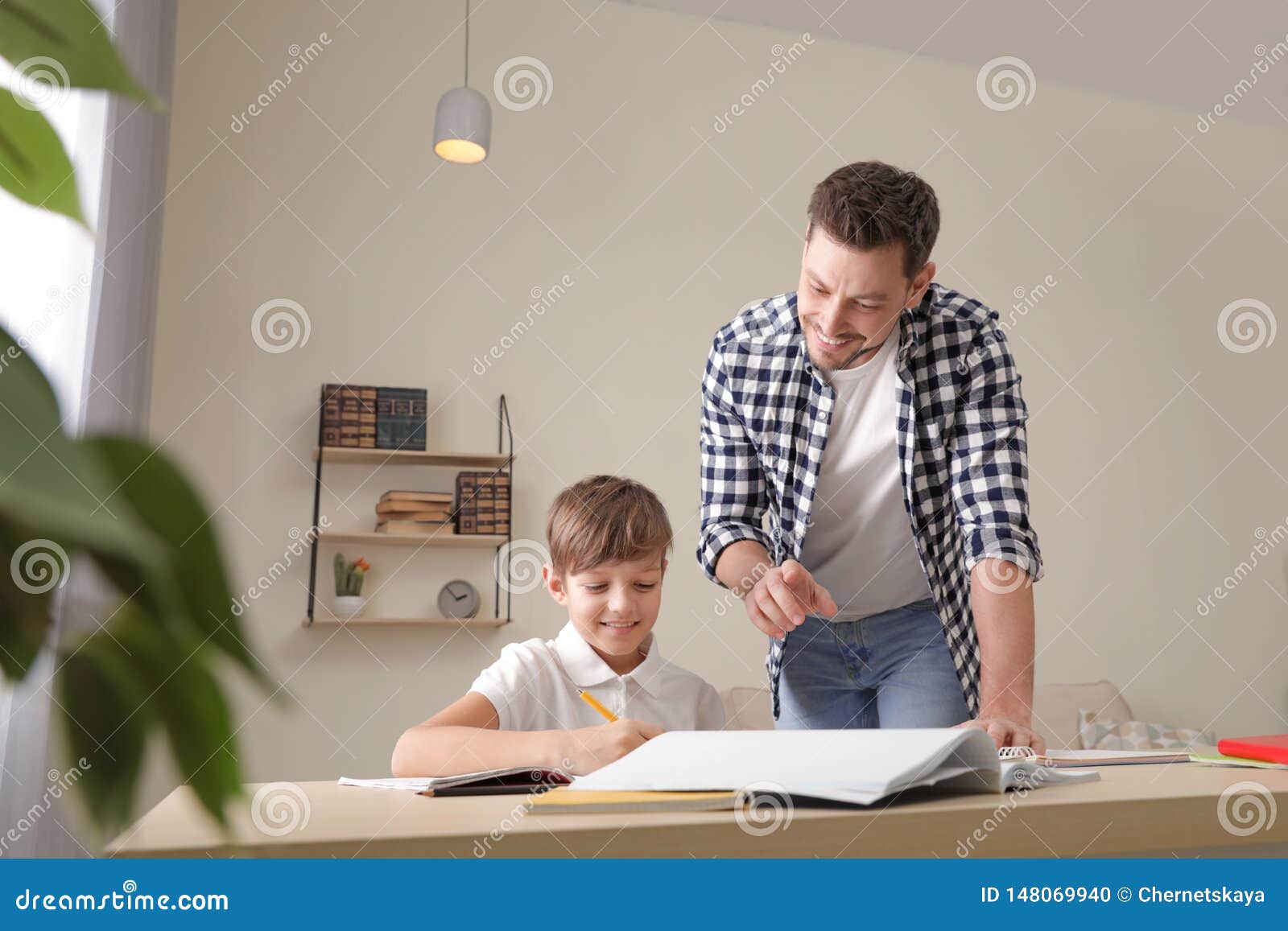 Dad Helping His Son with School Assignment Stock Photo - Image of ...