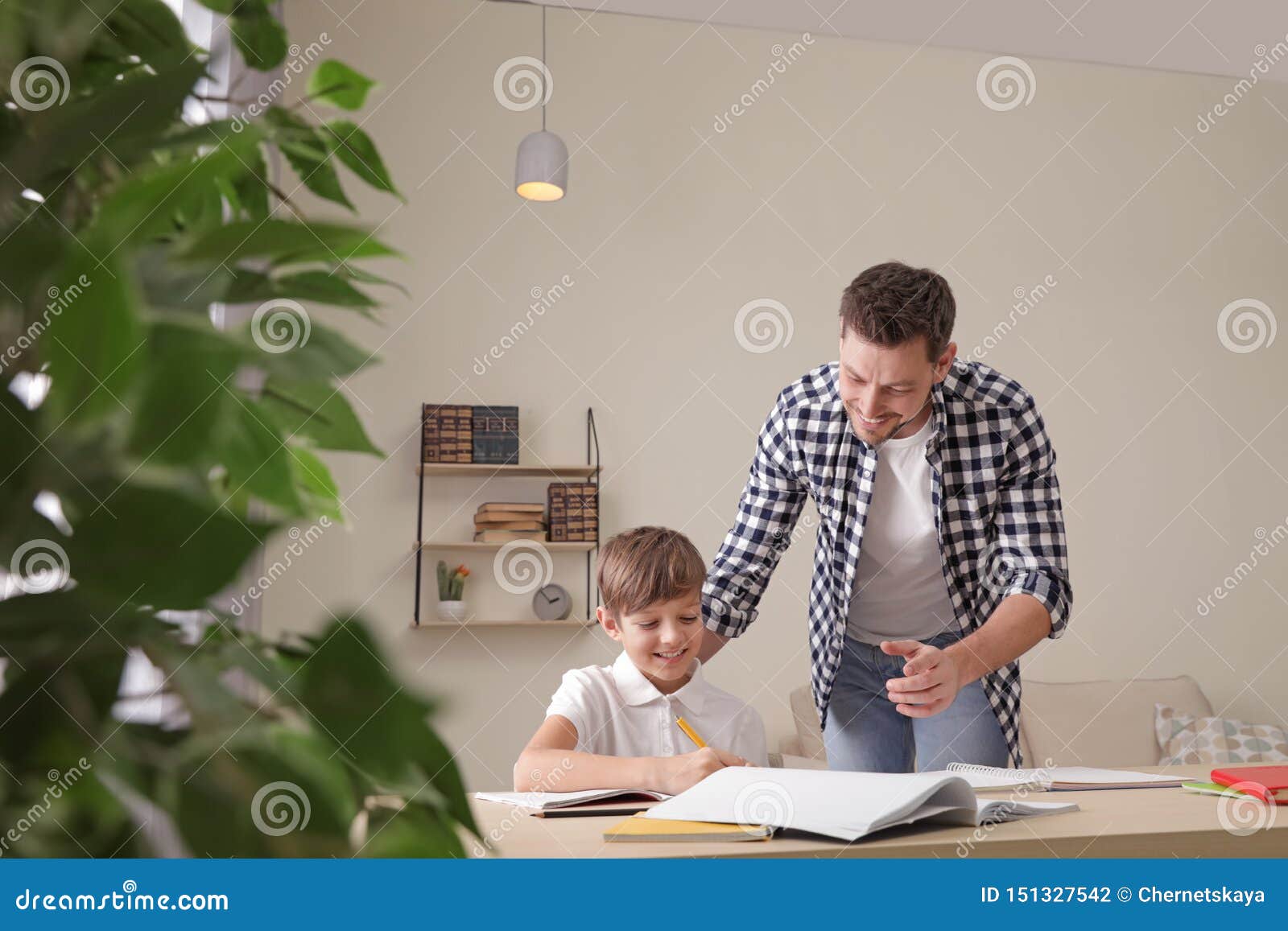 Dad Helping His Son with School Assignment Stock Photo - Image of ...
