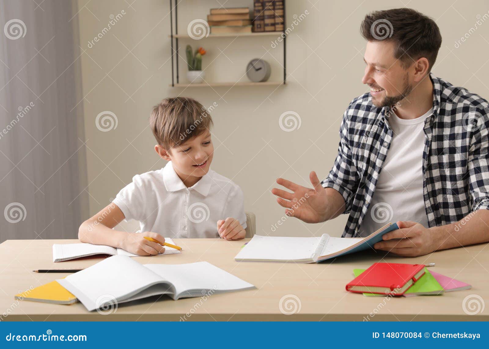 Dad Helping His Son with School Assignment Stock Photo - Image of ideas ...