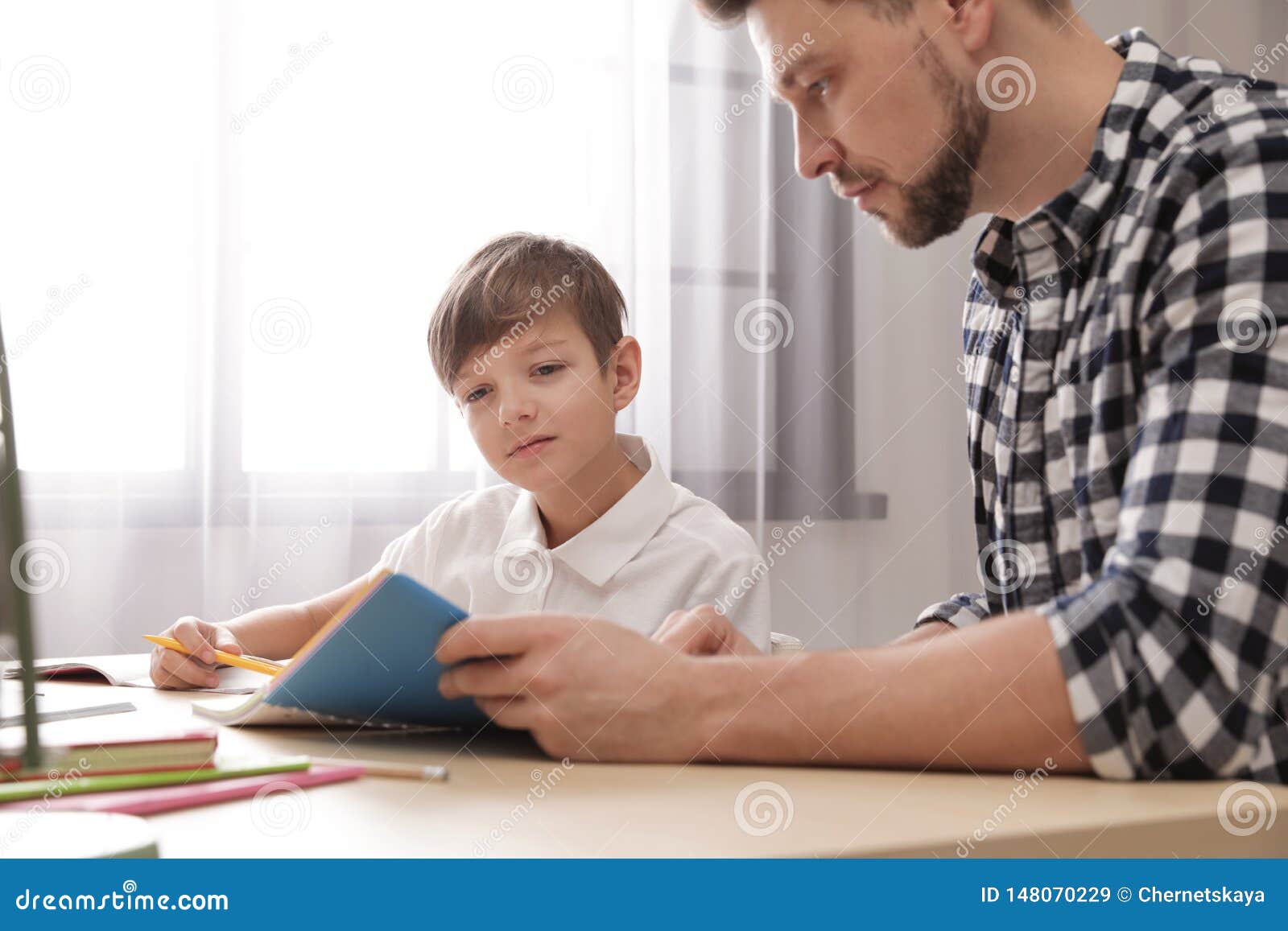 Dad Helping His Son with School Assignment Stock Image - Image of ...