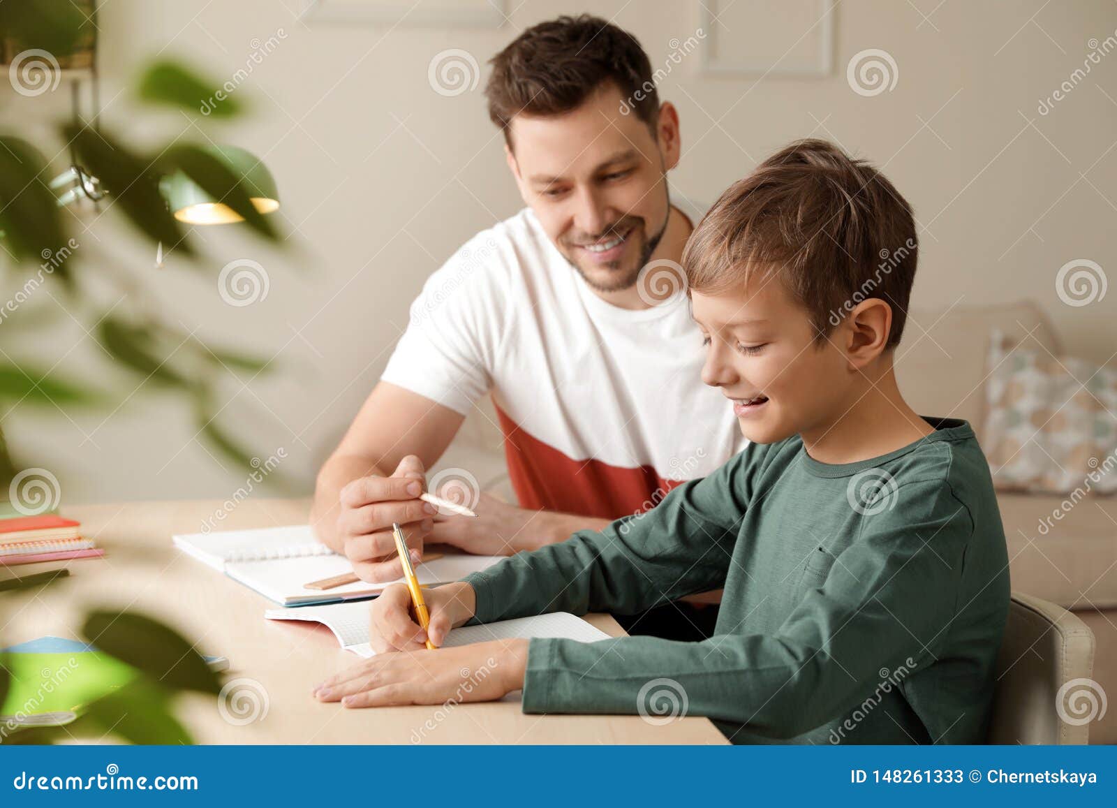 Dad Helping His Son with School Assignment Stock Image - Image of ...