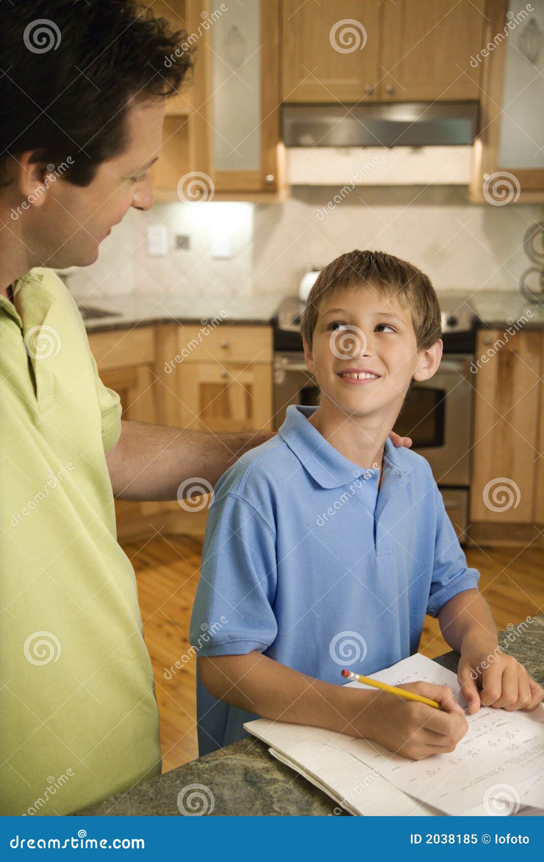 Dad Helping Son with Homework. Stock Image - Image of counter, routine ...