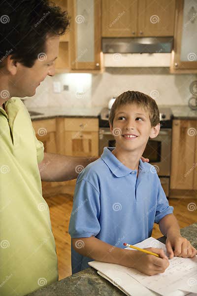 Dad Helping Son with Homework. Stock Image - Image of counter, routine ...
