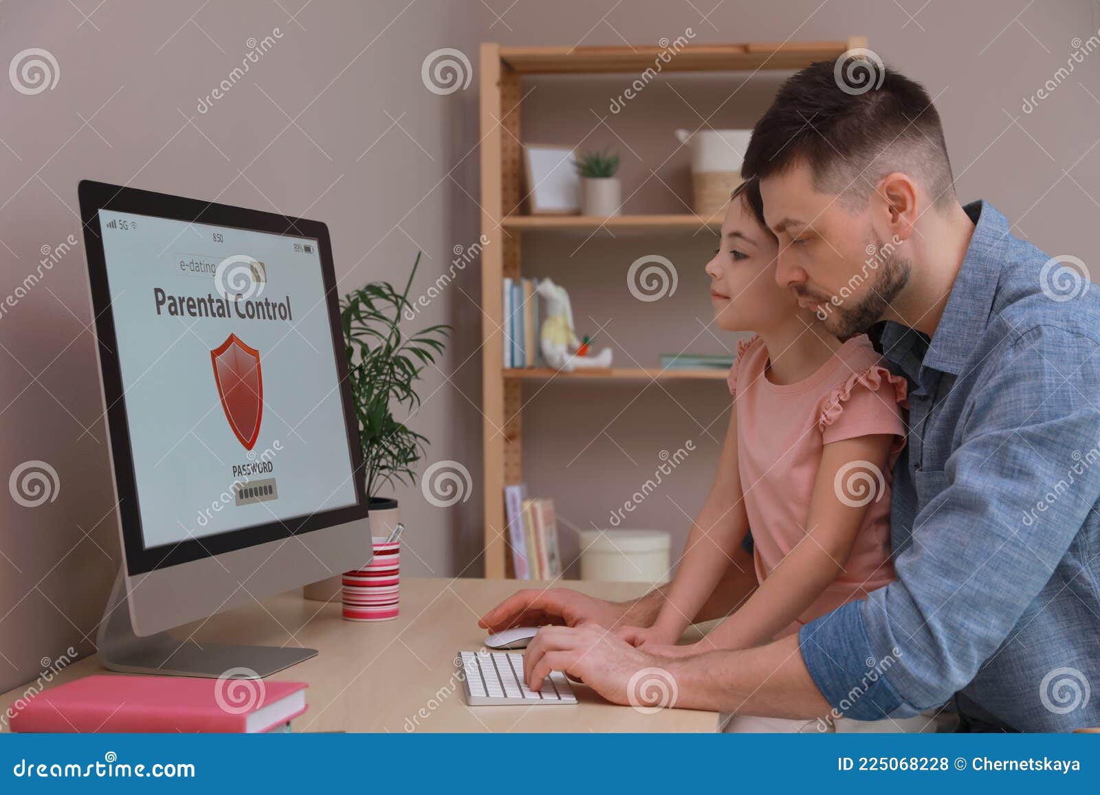 Dad Installing Parental Control on Computer at Table. Child Safety ...