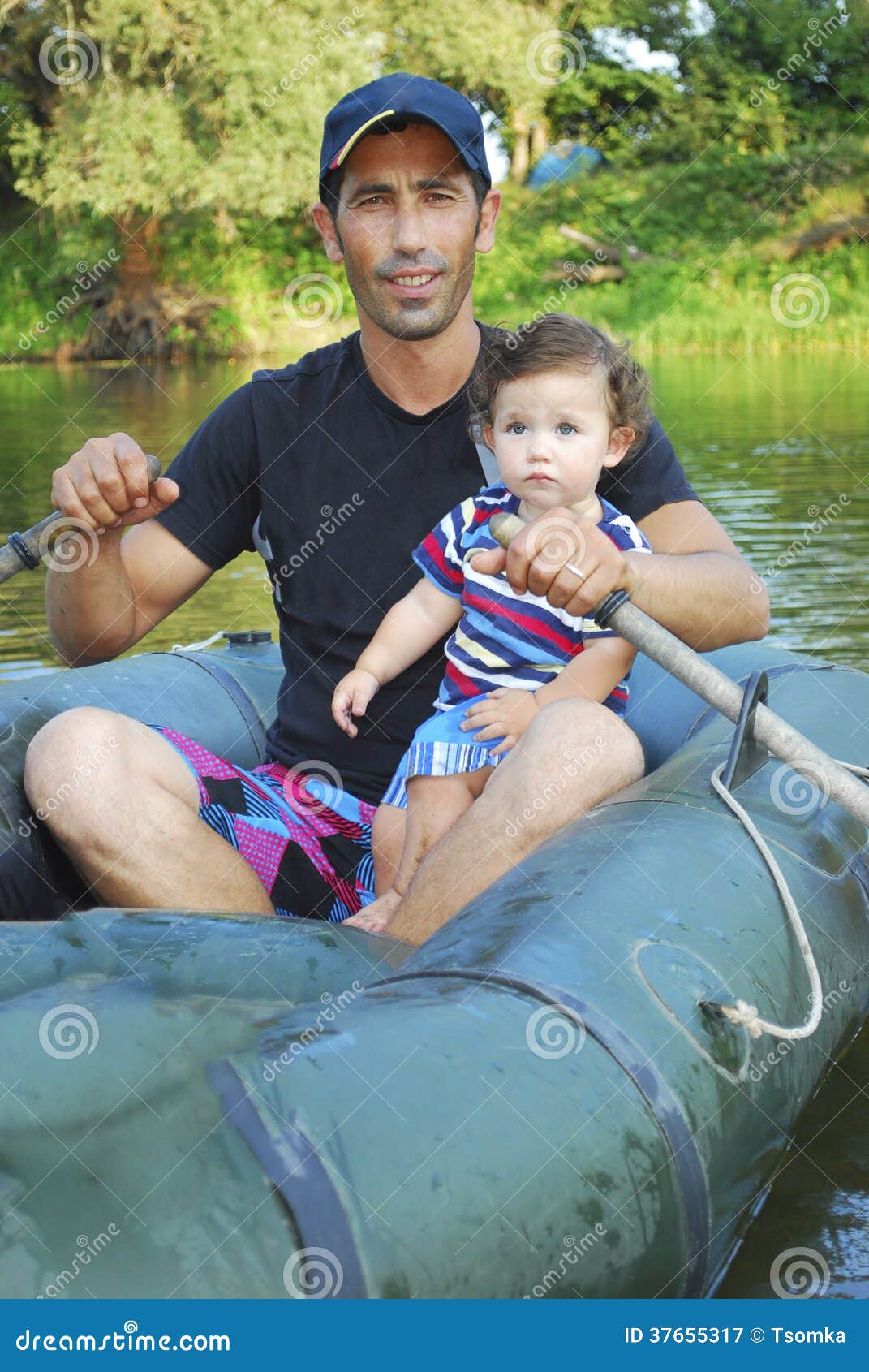 Dad with Little Daughter Sitting in a Boat on the River. Stock Image ...