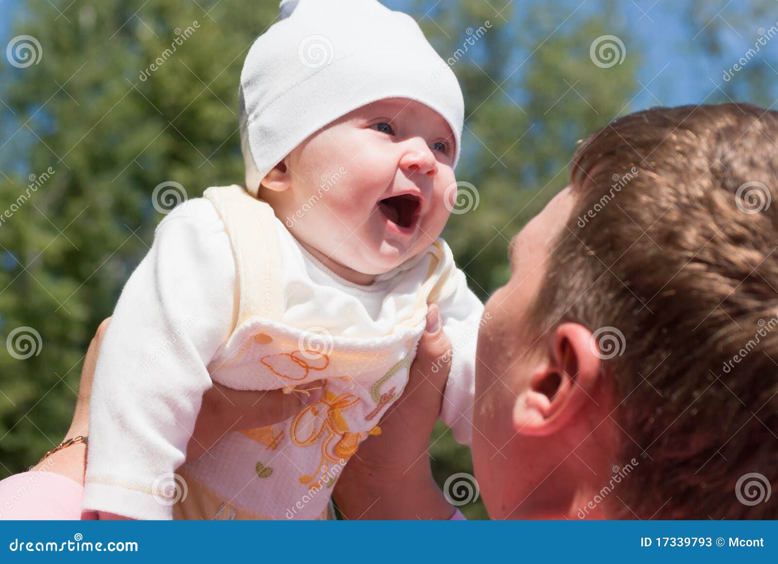 Dad looks at his baby stock image. Image of baby, smile - 17339793