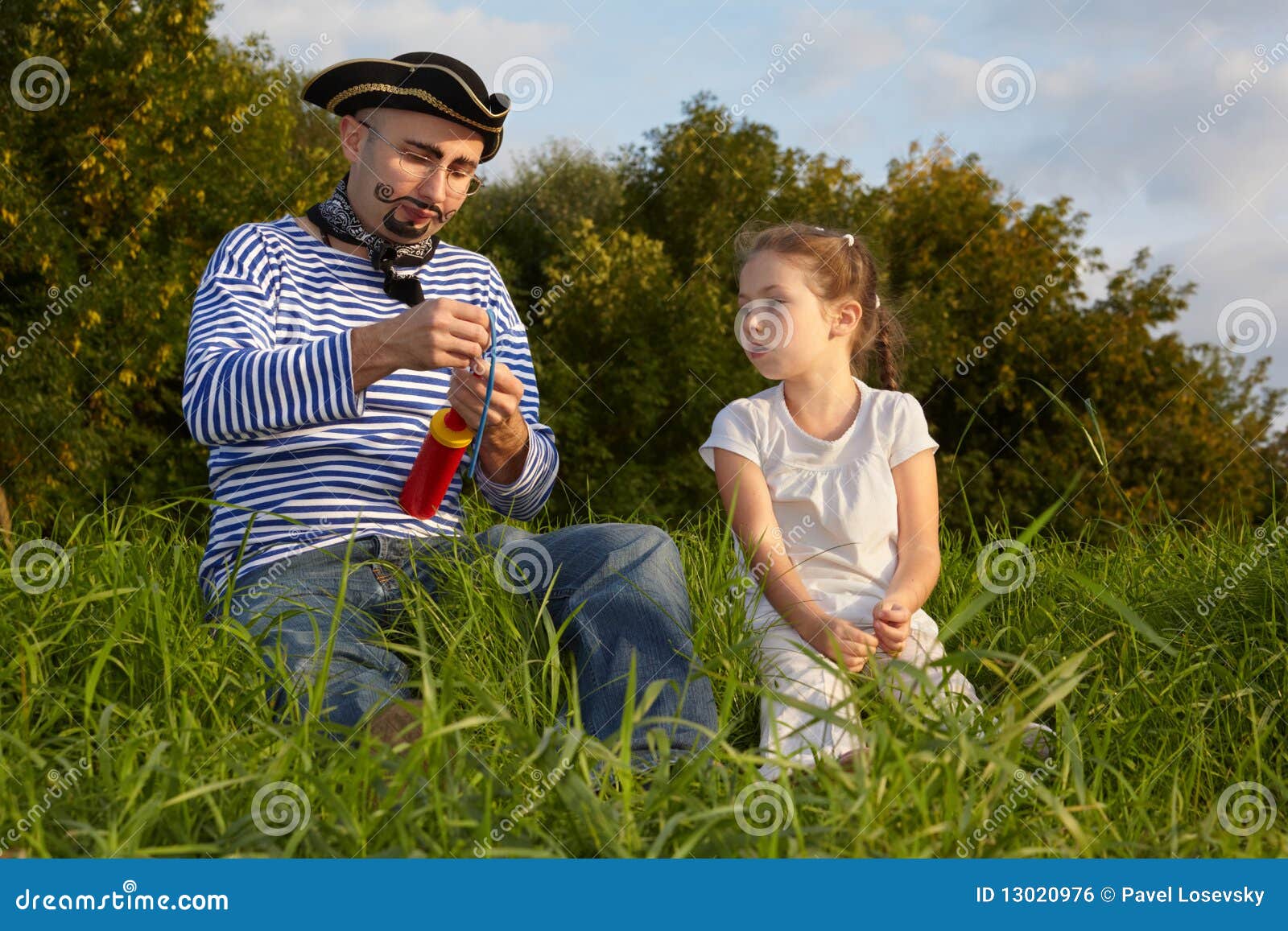 Dad in Pirate Suit and Daughter on Grass Stock Photo - Image of balloon ...