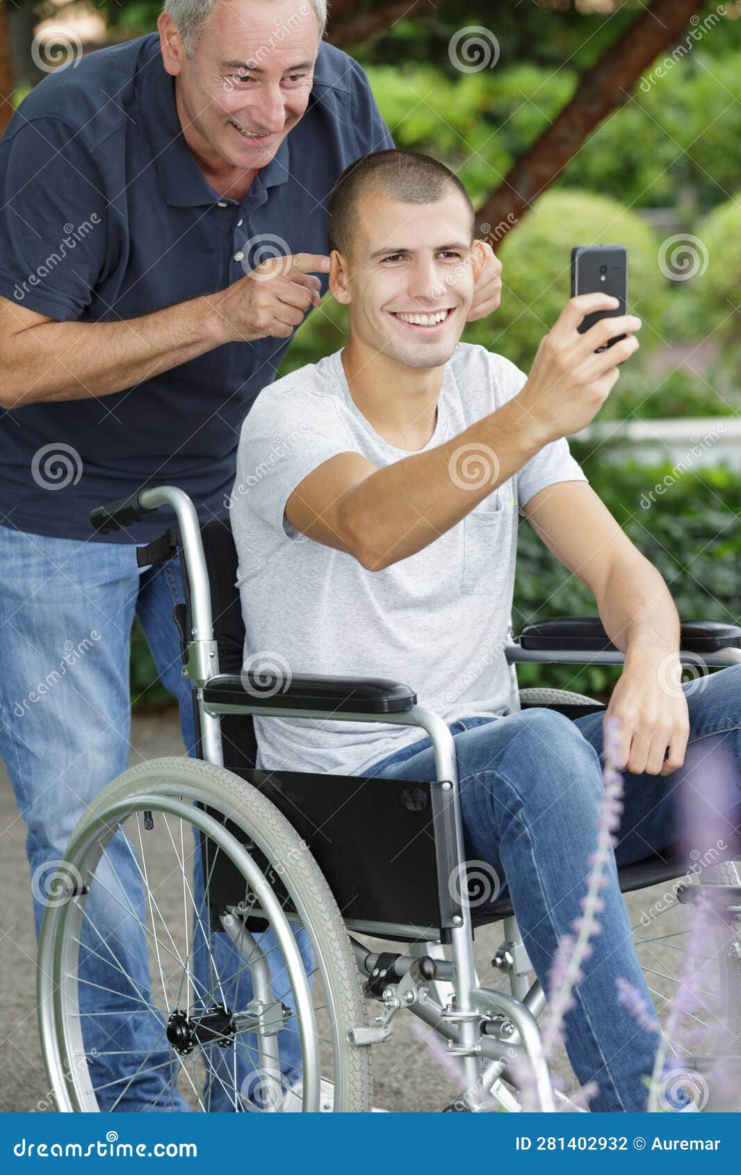 Dad Playfully Holding Handicapped Sons Ears Back for Selfie Stock Photo ...