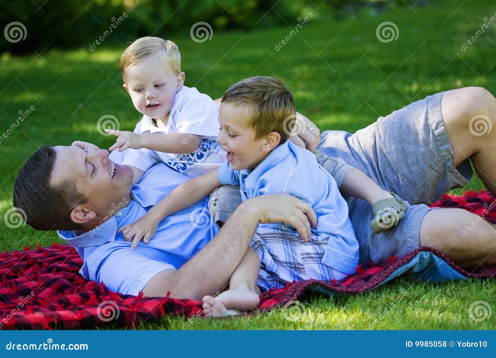 Dad playing with his kids stock photo. Image of dress - 9985058