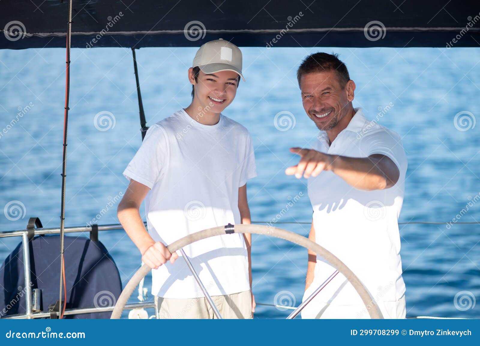 Dad Showing His Son How To Manage the Boat Stock Image - Image of ...