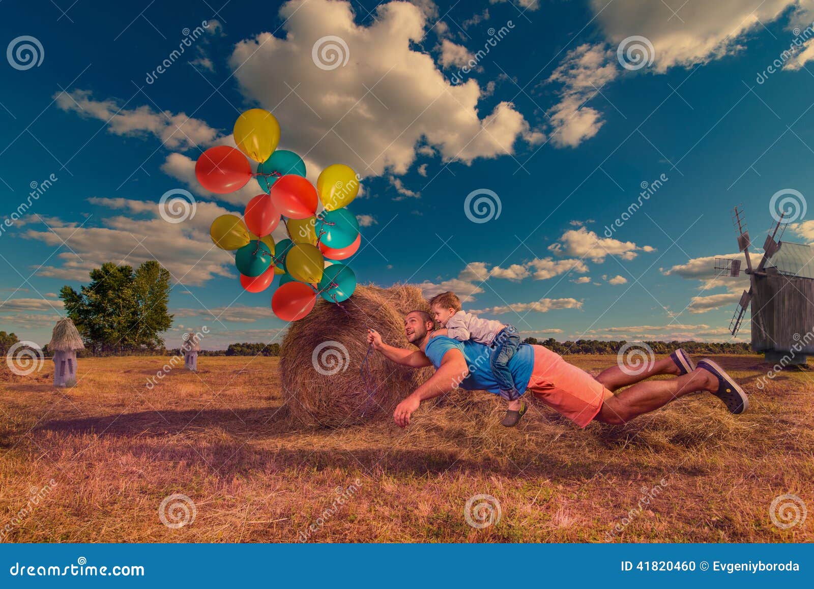 Dad and Son Flying Around Near the Stack of Hay Stock Photo - Image of ...