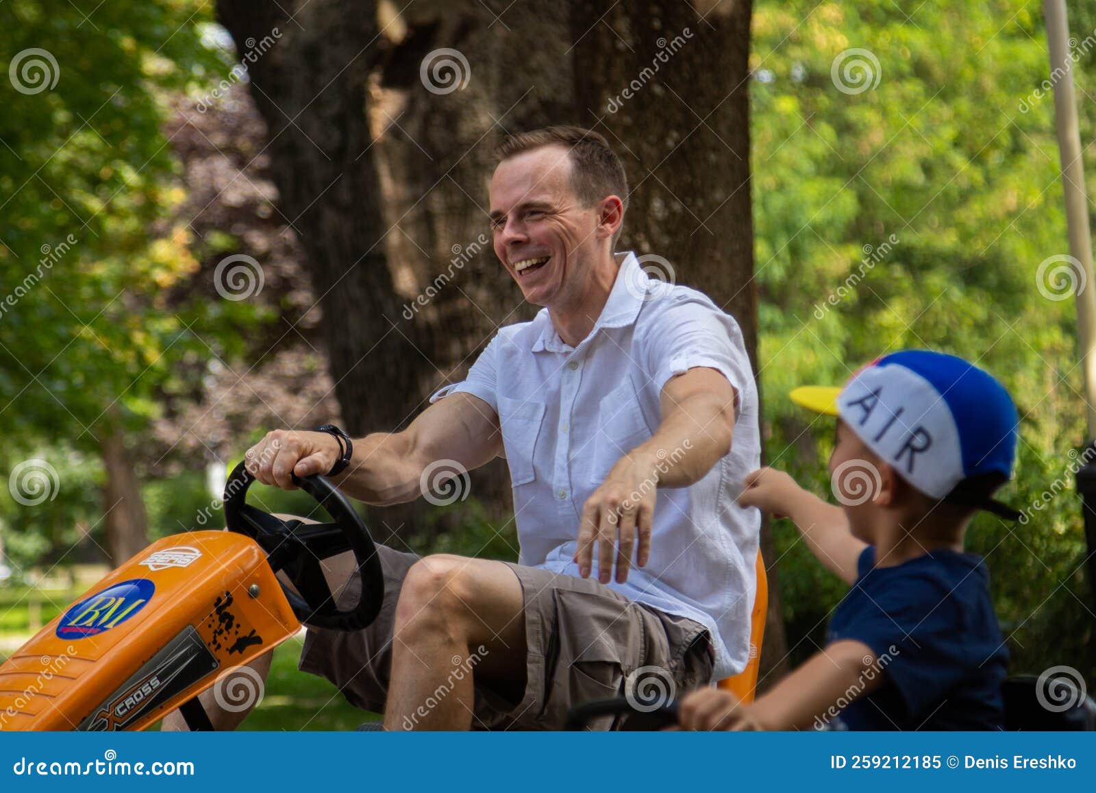 Dad and Son Have Fun in the Park Stock Image - Image of sports, vehicle ...