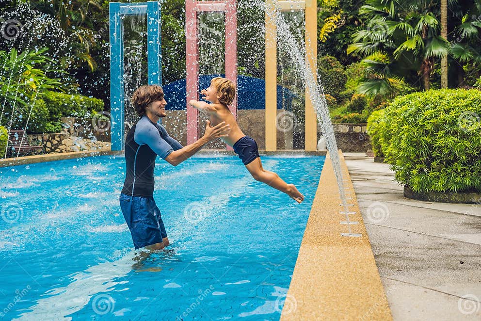 Dad and Son Have Fun in the Pool Stock Image - Image of caucasian ...