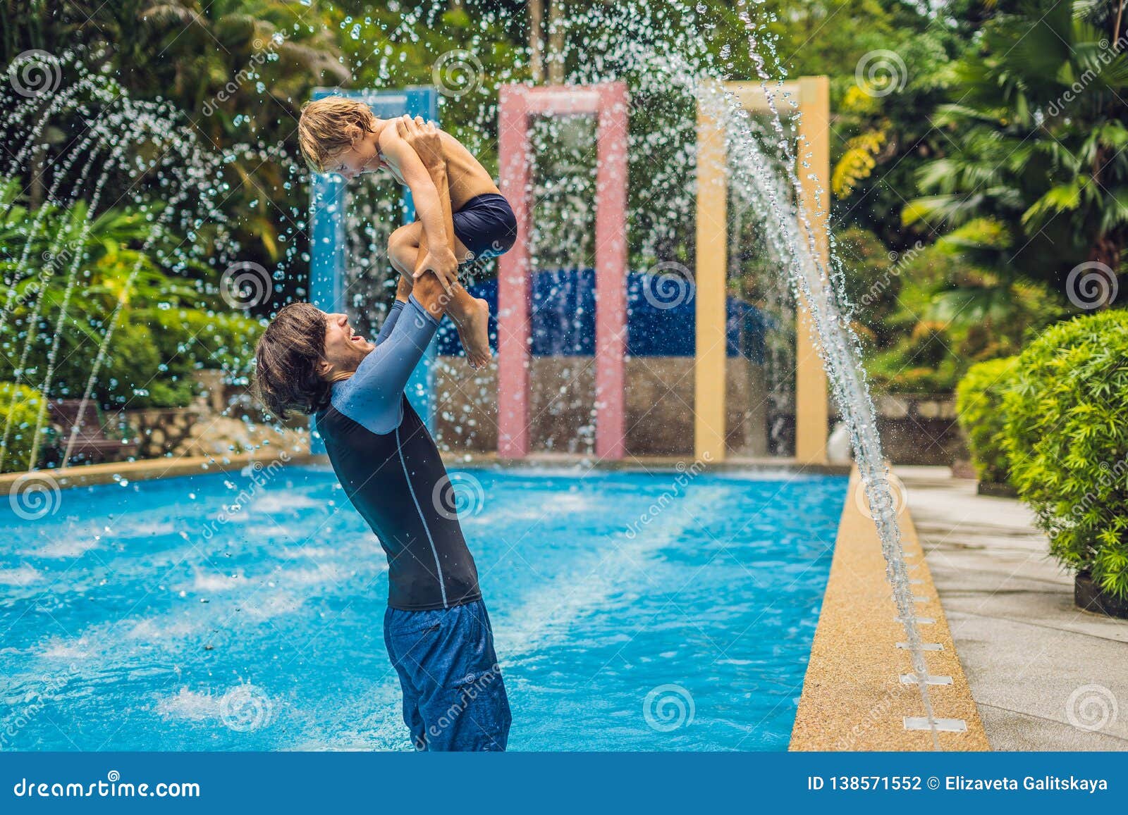 Dad and Son Have Fun in the Pool Stock Photo - Image of holiday, jump ...