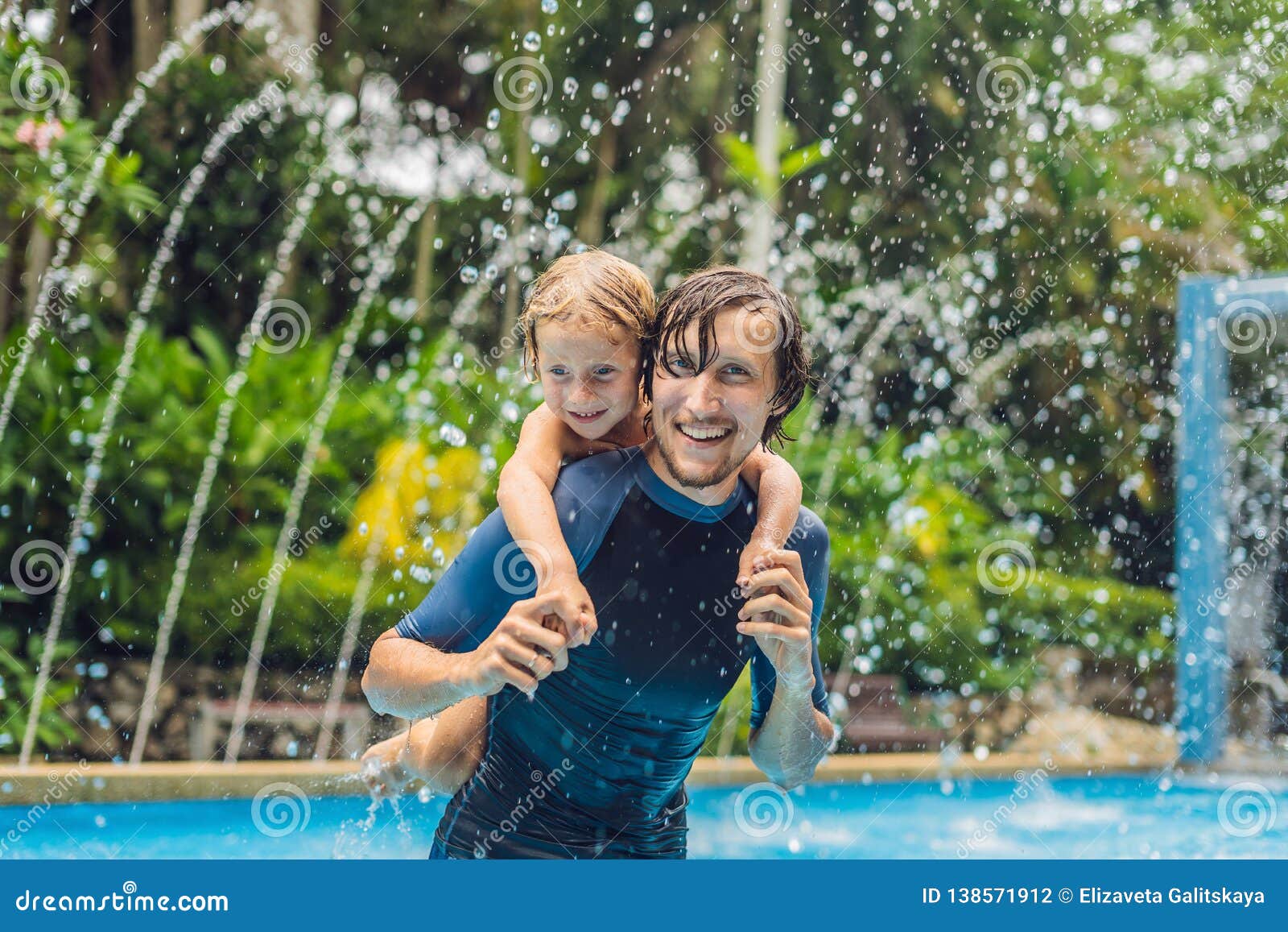 Dad and Son Have Fun in the Pool Stock Photo - Image of male, playful ...
