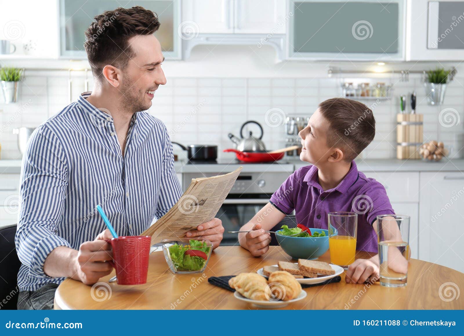 Dad and Son Having Breakfast Together Stock Photo - Image of child ...