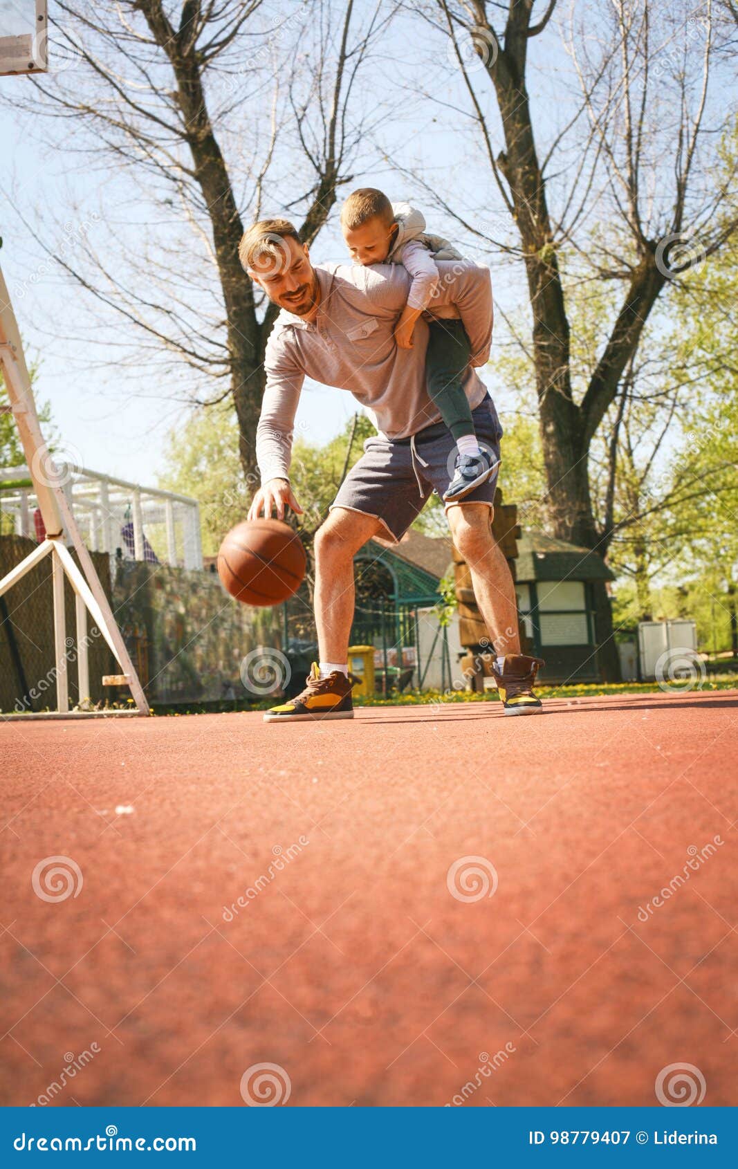 Dad and son. stock image. Image of outdoors, child, playful - 98779407