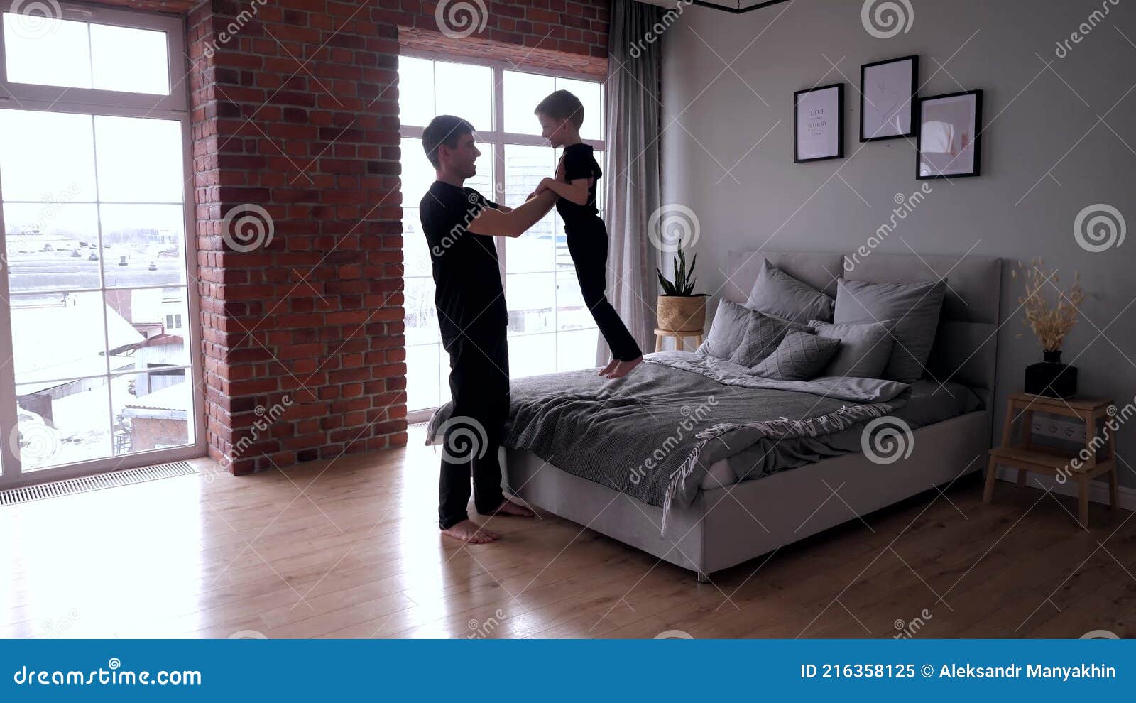 Dad and son are home alone stock video. Video of happiness - 216358125