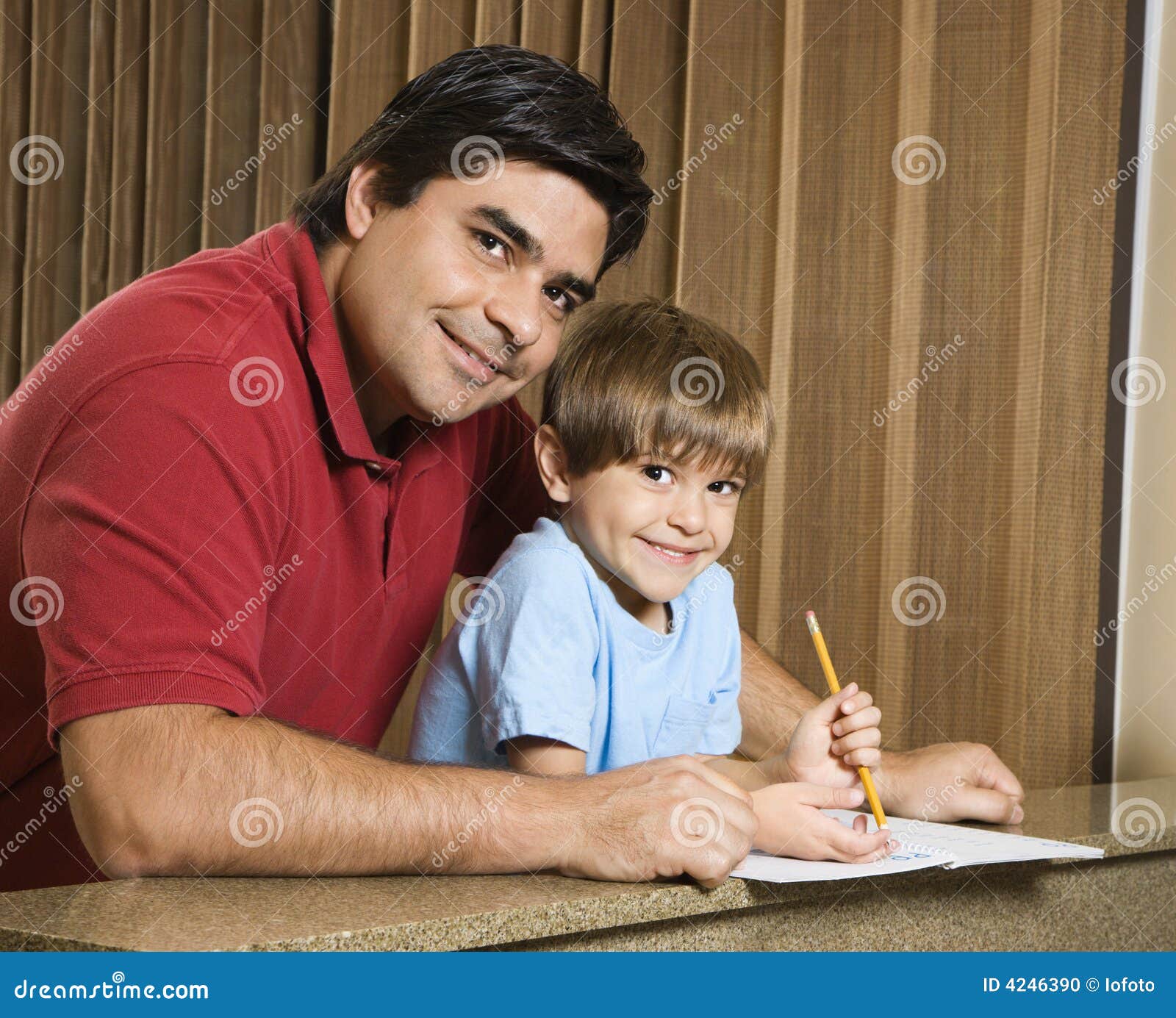 Dad and son with homework. stock photo. Image of contact - 4246390