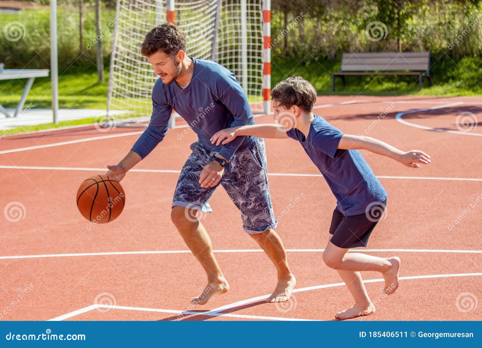 Dad and Son Playing Basketball on a Playground Stock Image - Image of ...