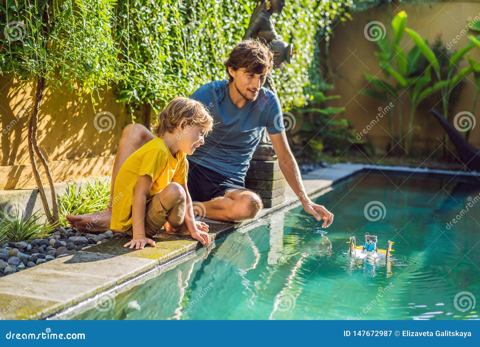 Dad and Son Playing with a Boat in the Pool Stock Image - Image of ...