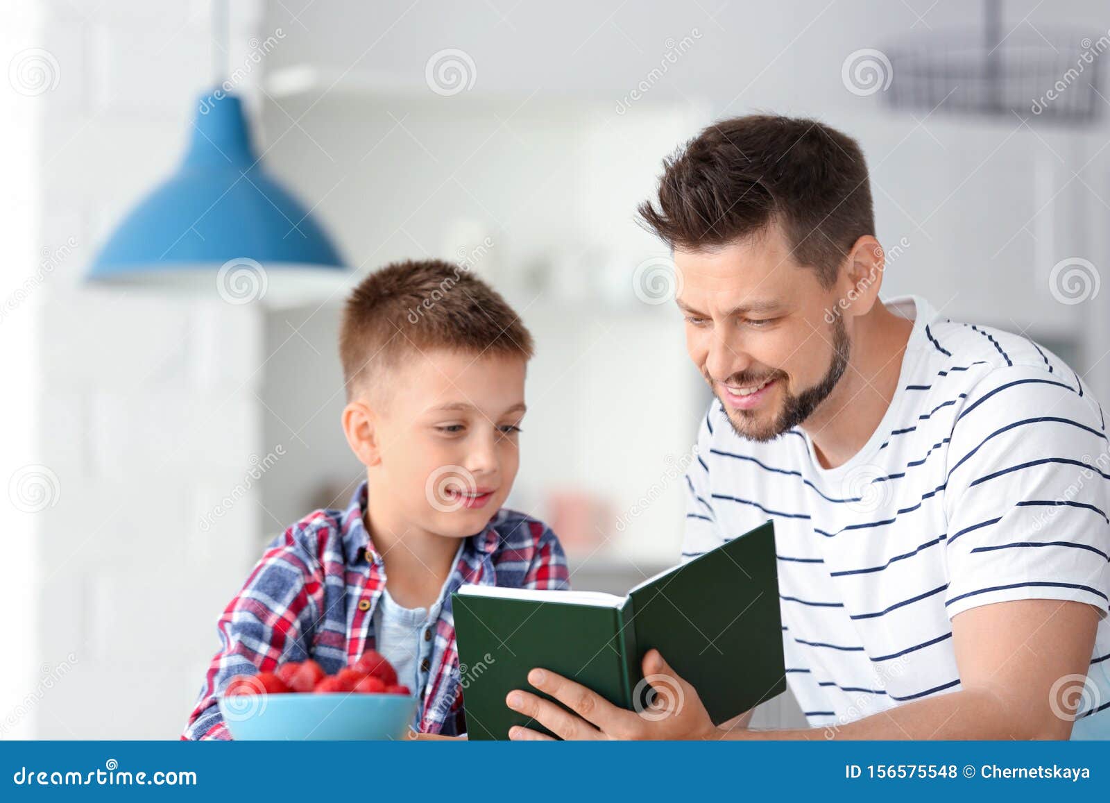 Dad and Son Reading Interesting Book Stock Photo - Image of family ...