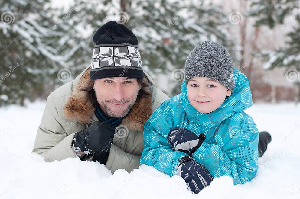 Dad and Son Rest in the Snow Stock Image - Image of snow, forest: 22922851