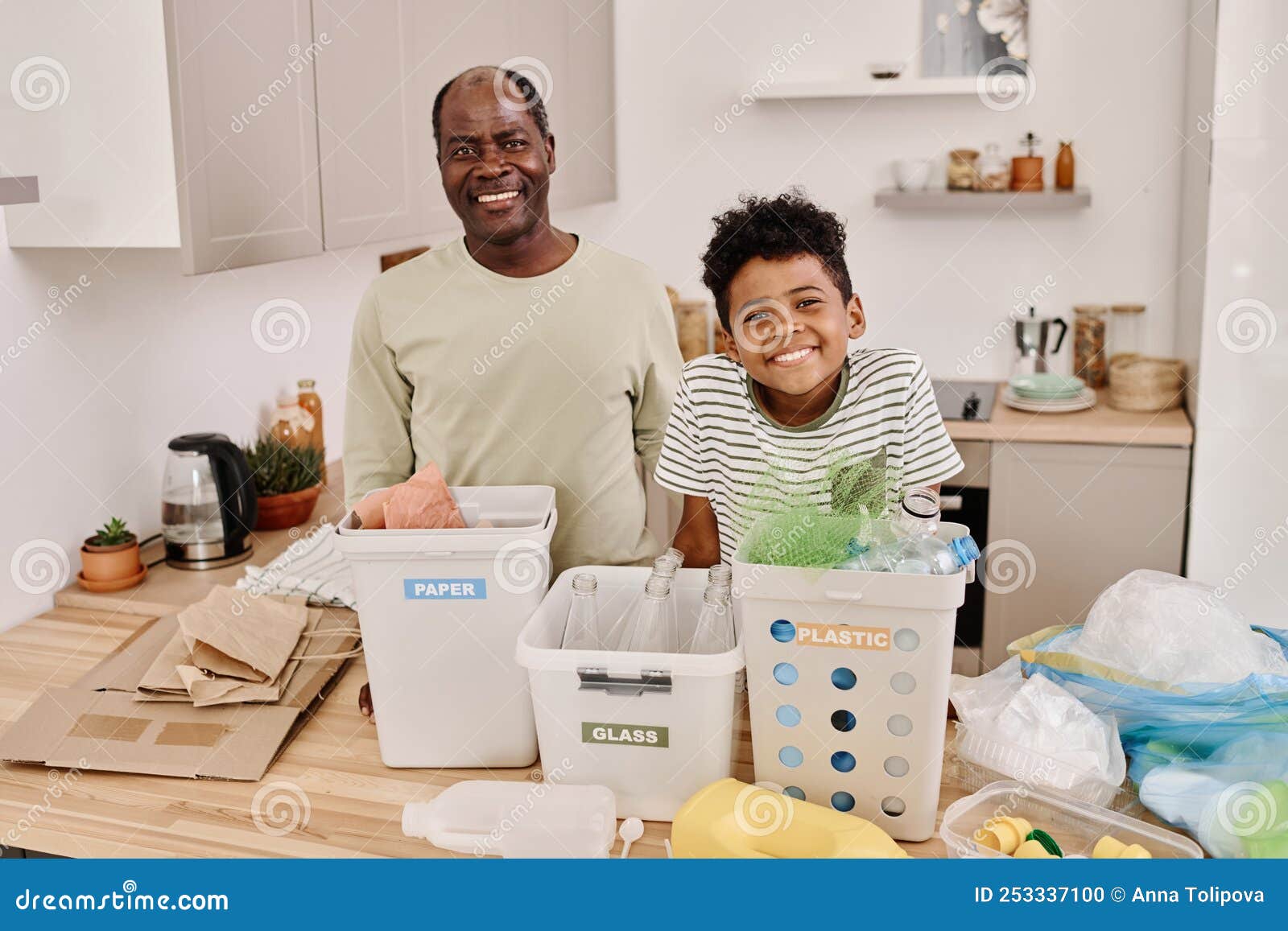 Dad and Son Sorting Garbage in Kitchen Stock Photo - Image of ...