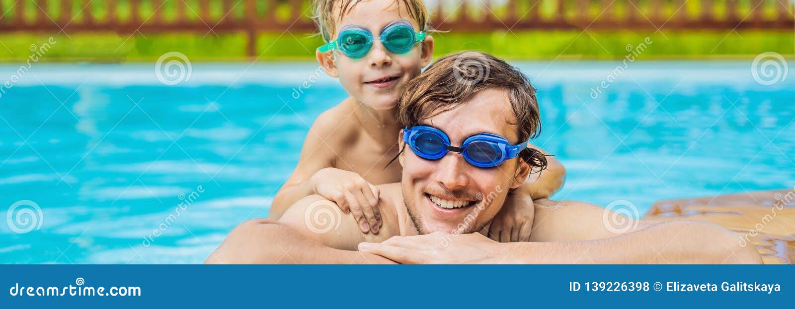 Dad and Son in Swimming Goggles Have Fun in the Pool BANNER, LONG ...