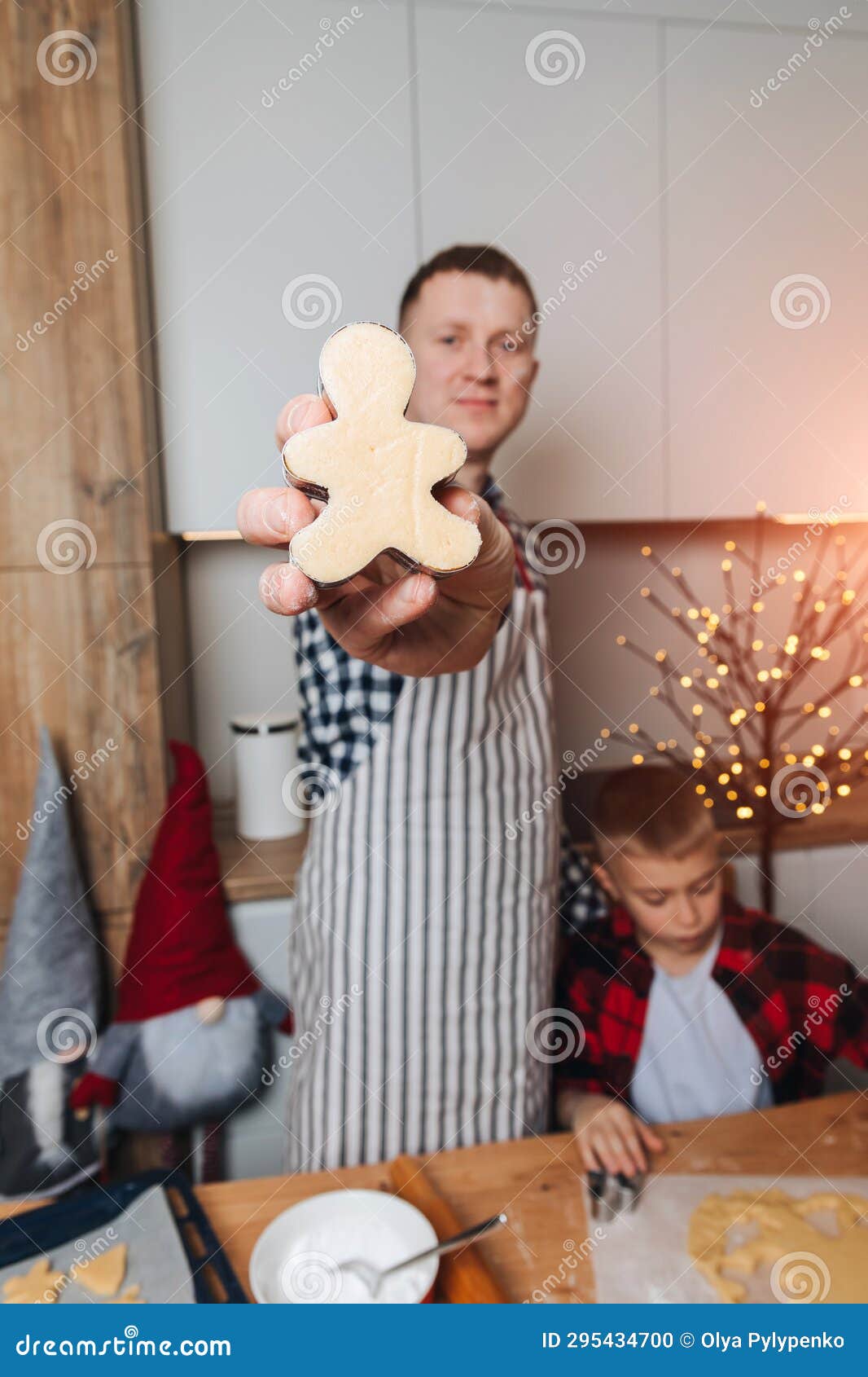 Dad and Son at a Wooden Table in the Kitchen are Making Cookies in the ...