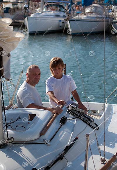 Dad and son on a yacht. stock image. Image of cute, pier - 16986063