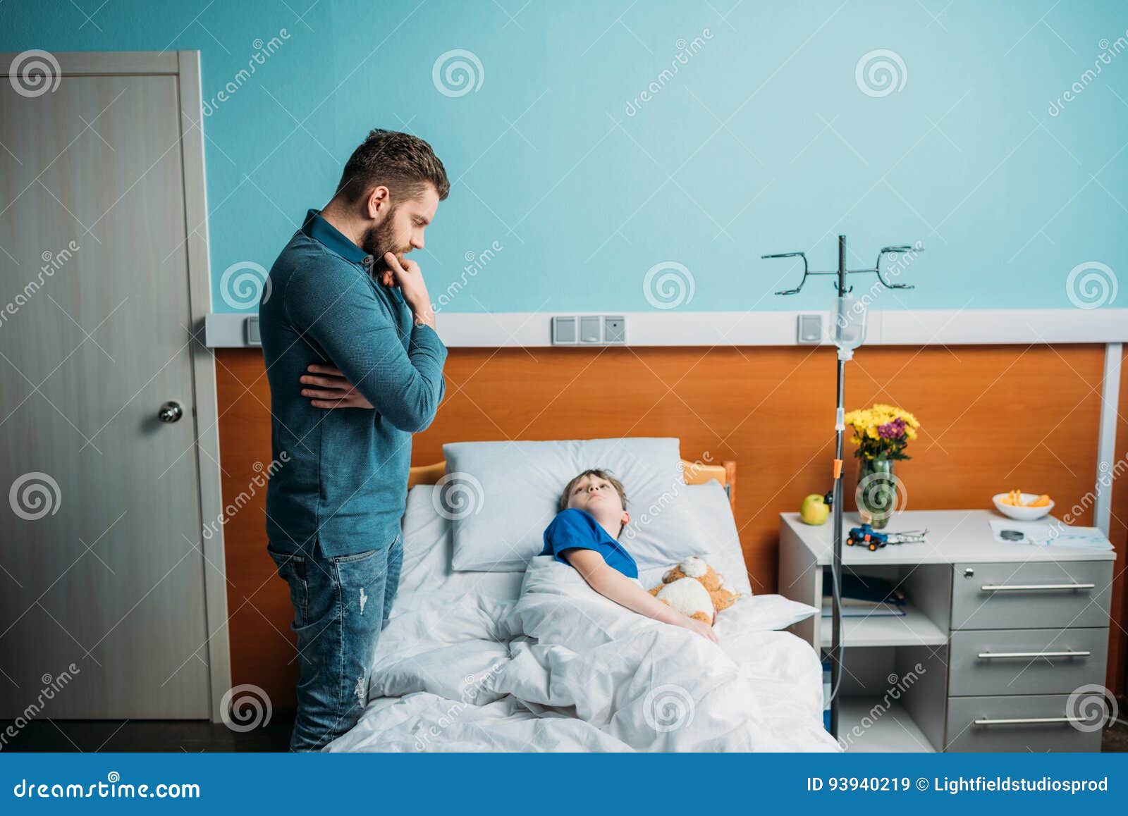 Dad Standing Near Sick Son in Hospital Bed Stock Image - Image of ...