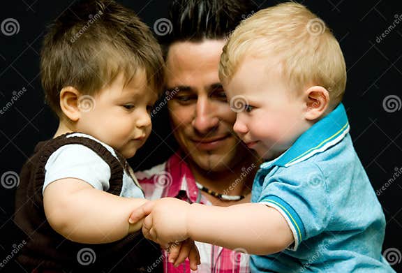 Dad with two sons stock image. Image of toddlers, care - 15954741