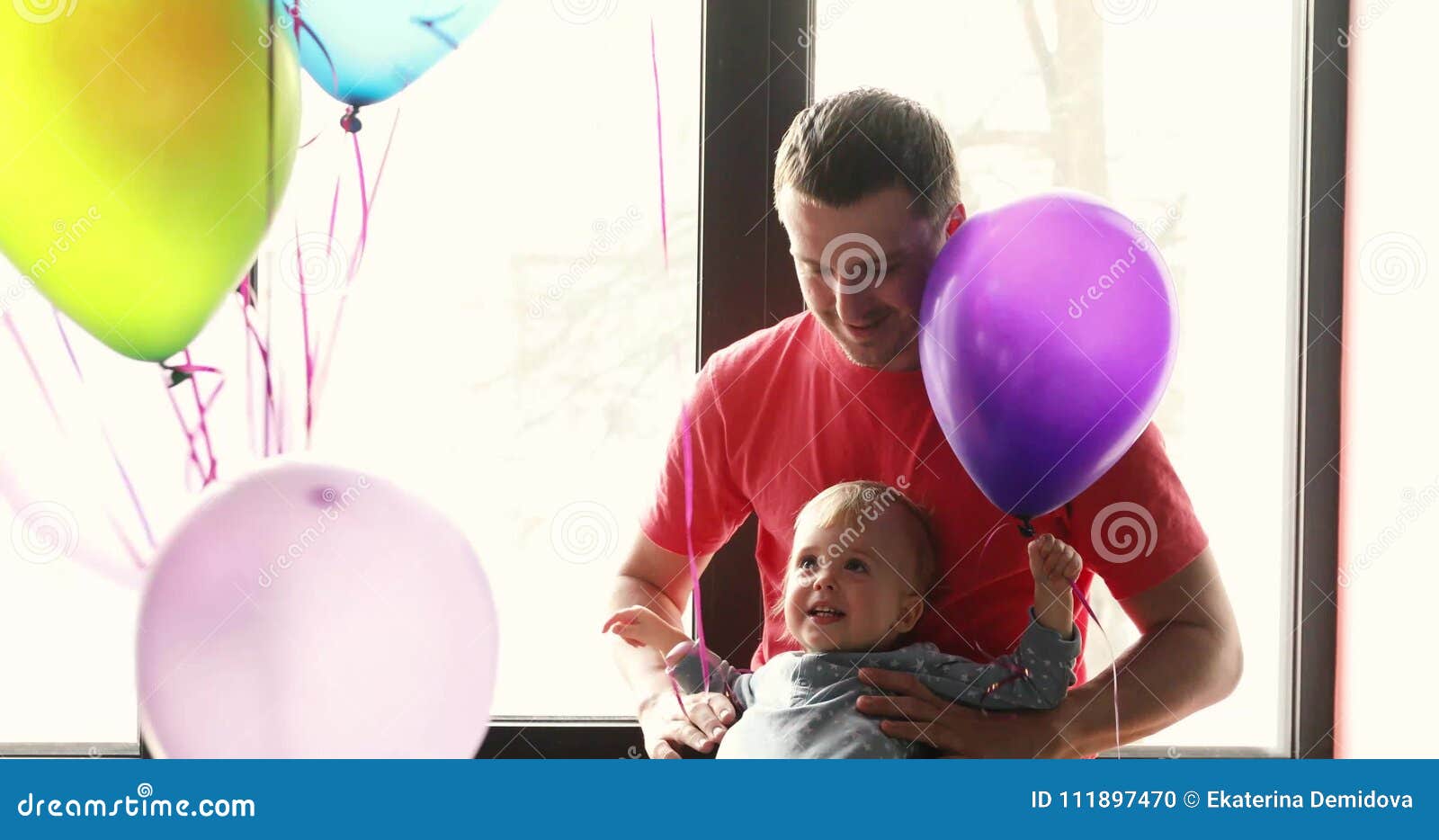 The Daddy with the Baby Boy Look at a Balloon Stock Footage - Video of ...