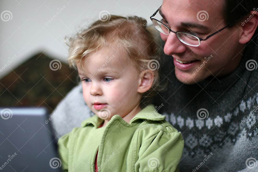 Daddy and Baby at Computer stock image. Image of type - 2762433